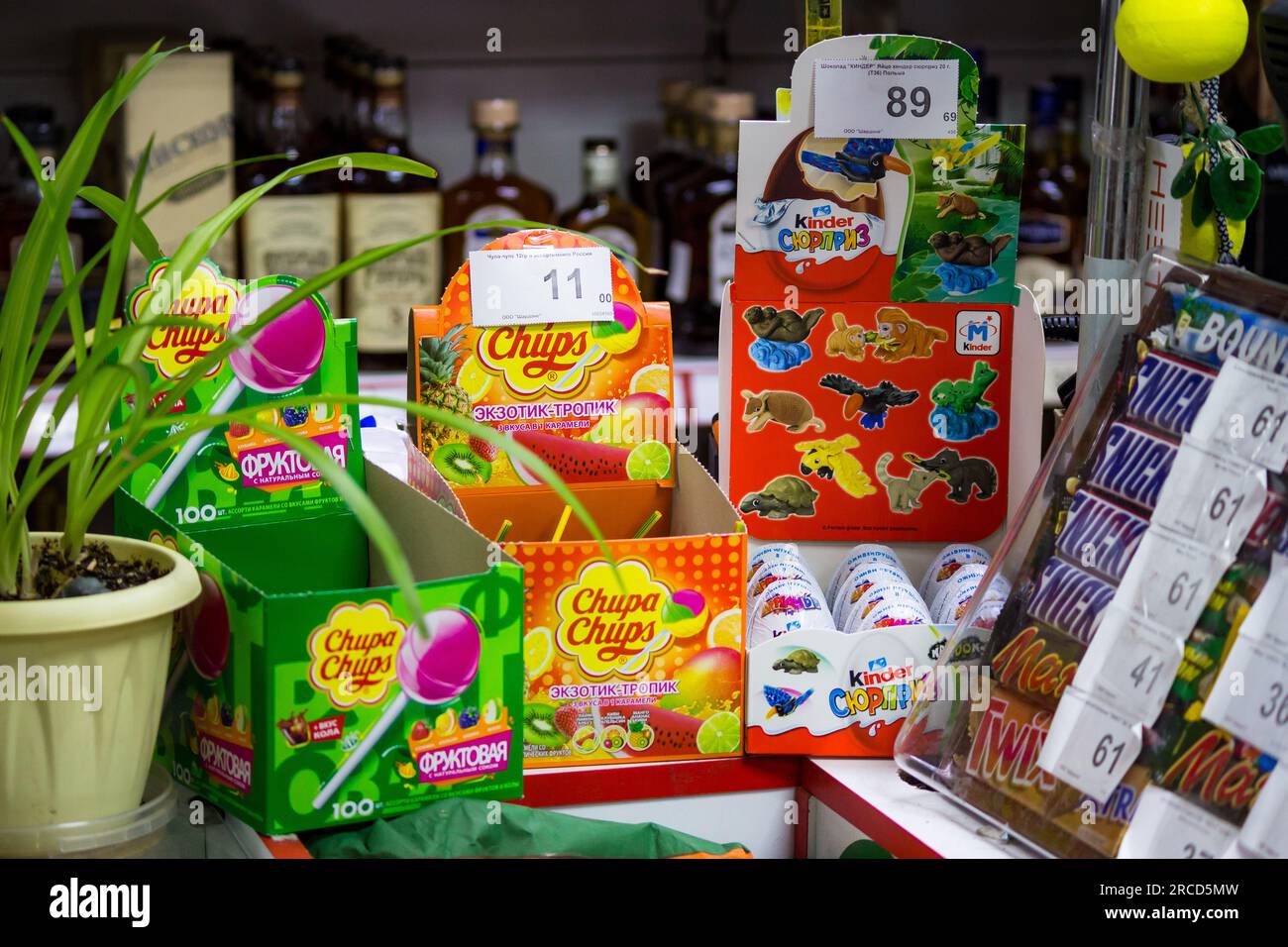 Sweets at the checkout in the store, sale of Chupa-Chups, Kinder ...