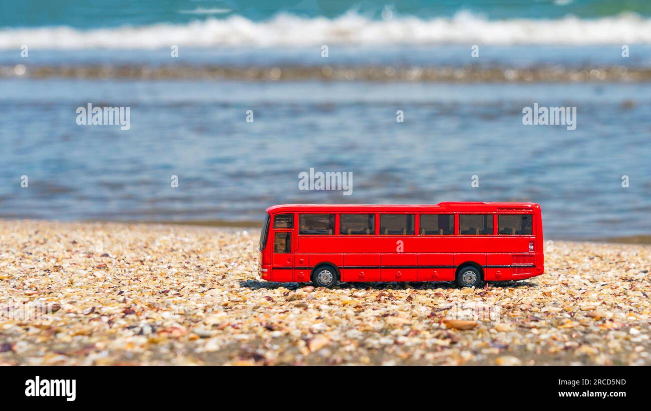 Tourist bus on the sea shore. Summer vacation Stock Photo - Alamy