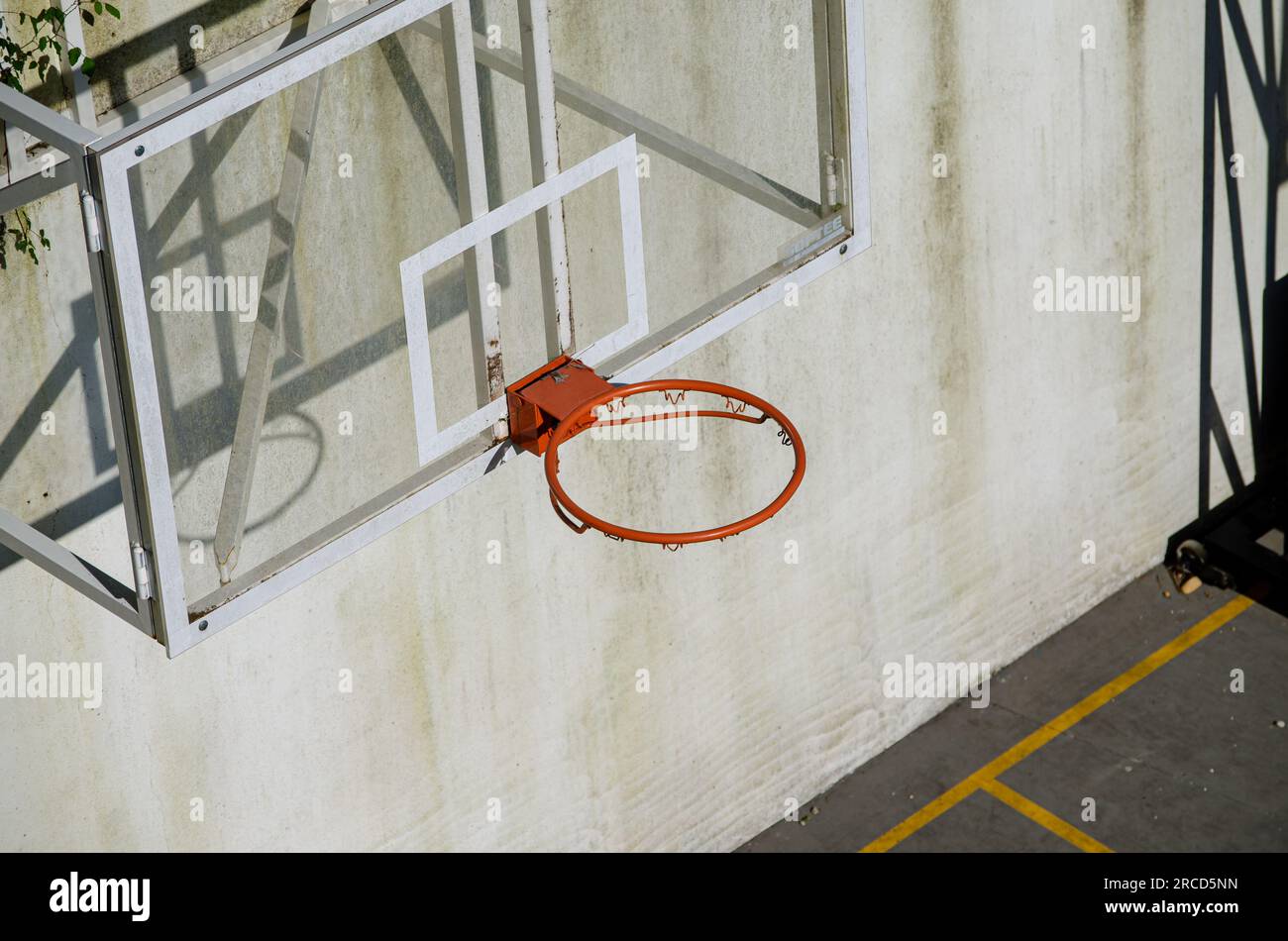 Basketball hoop hanging on a wall in a public playground Stock Photo ...