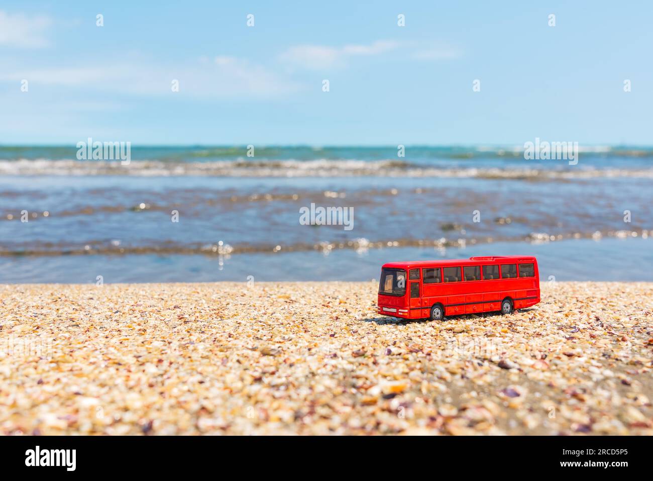 Tourist bus on the sea shore. Summer vacation Stock Photo - Alamy
