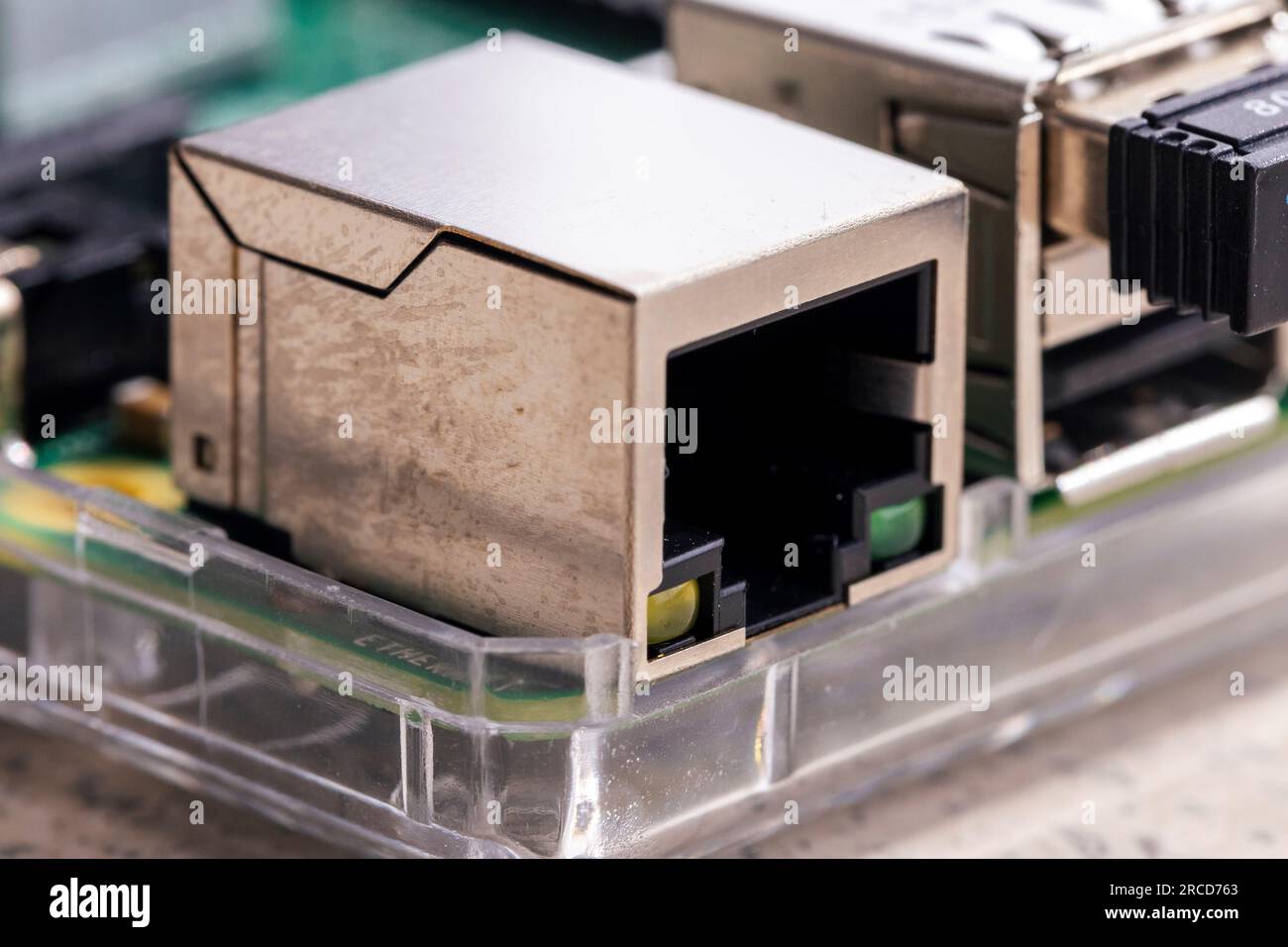 A portrait of a ethernet network port on a pcb or circuit board. The ...