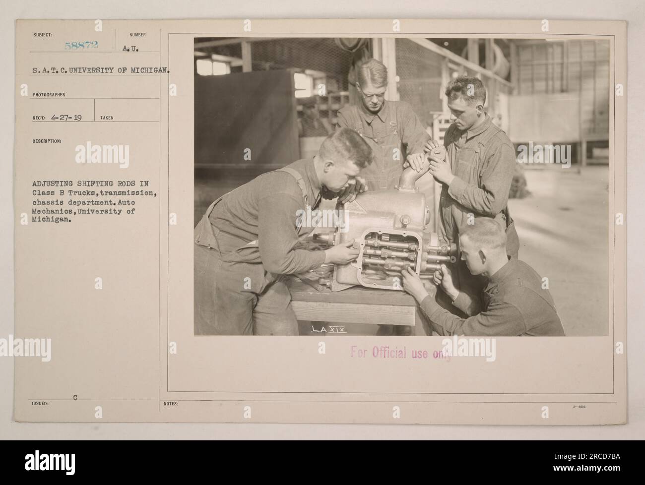 Auto mechanics at the University of Michigan are seen adjusting ...