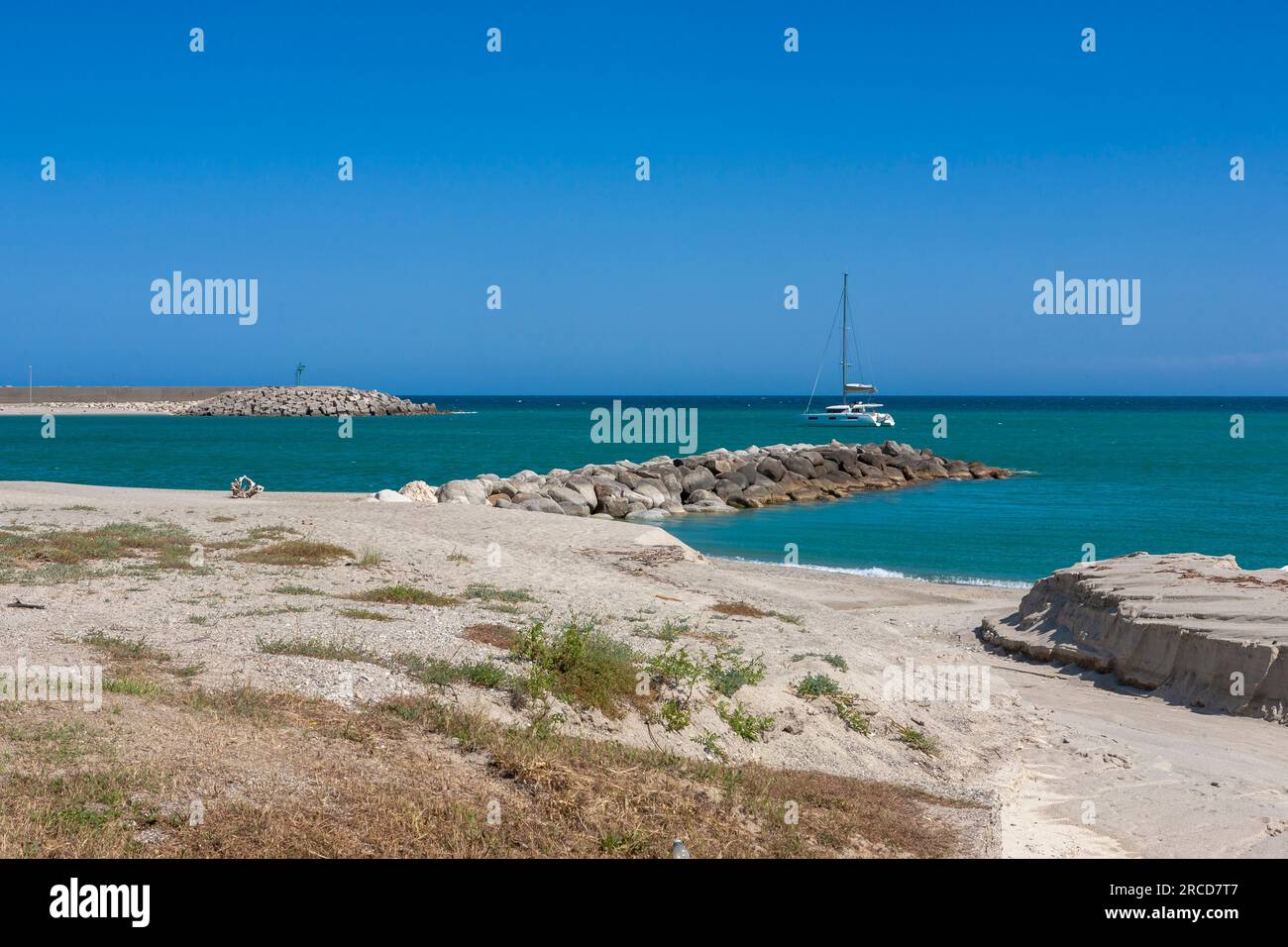 The beach at Roccella Ionica, Calabria, Italy, with a cruising ...