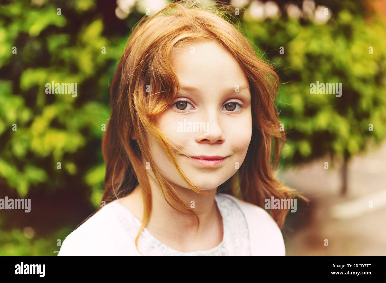 Close up outdoor portrait of adorable little girl of 8-9 years old ...
