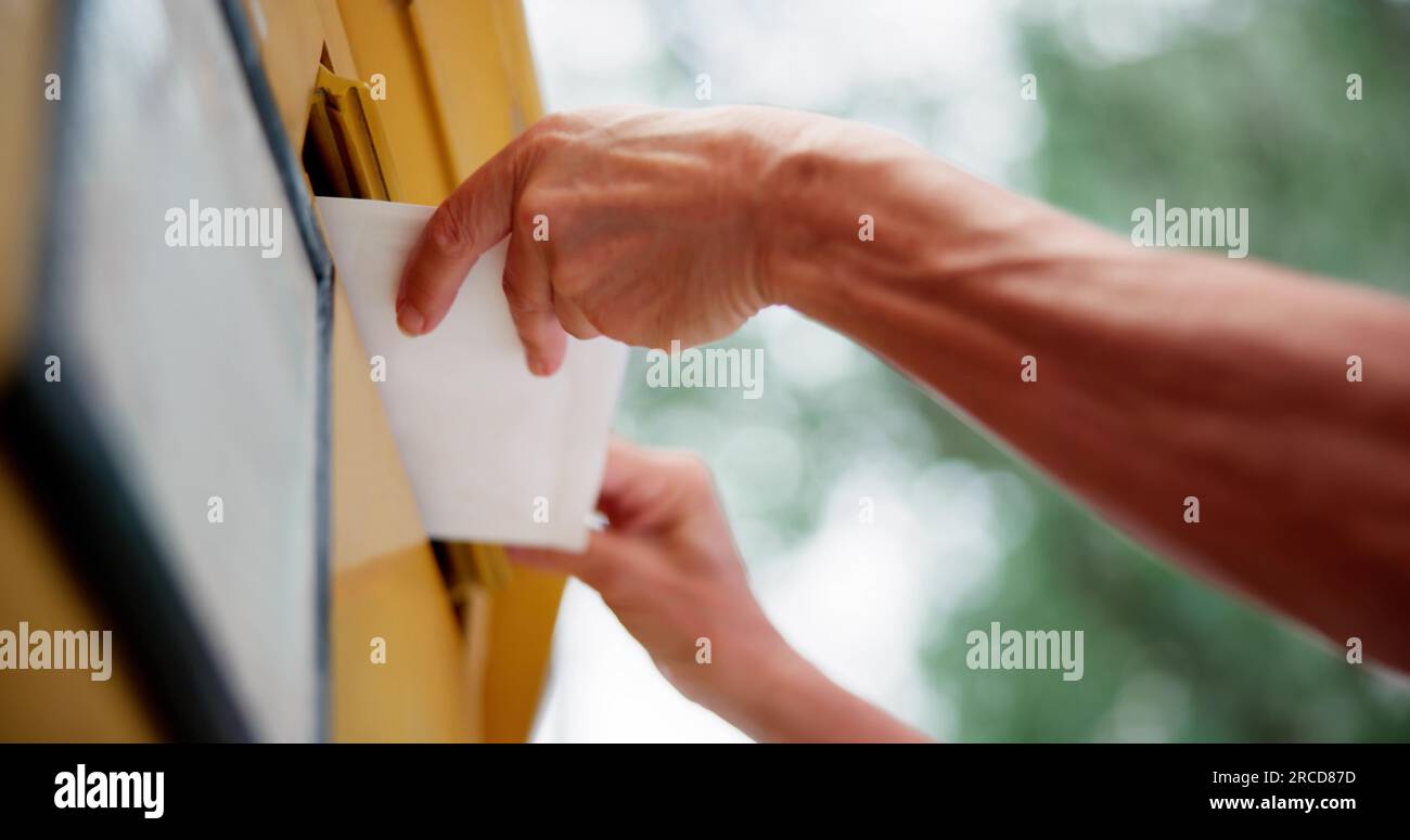 Postbox Envelope Mail Delivery. Inserting Letter In Mailbox Stock Photo ...
