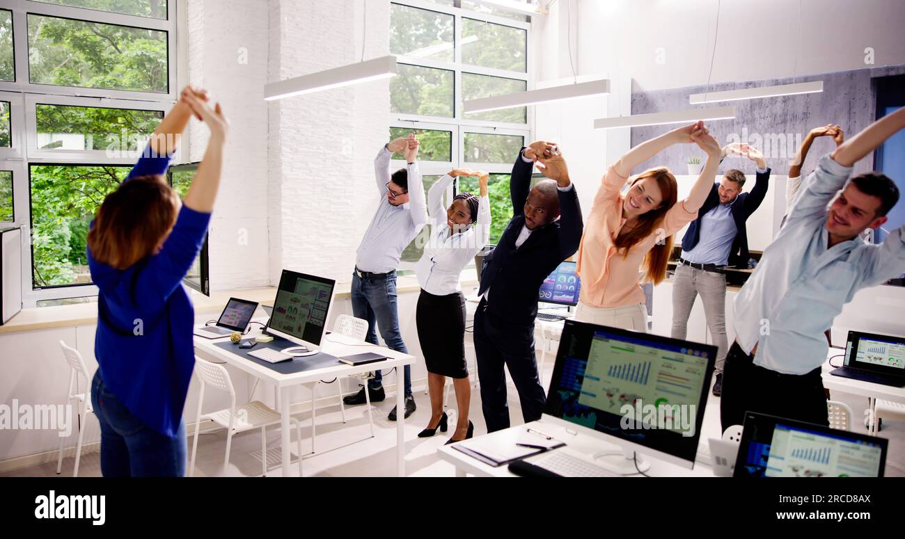 Stretch Exercise In Office For Business Worker Team Stock Photo - Alamy