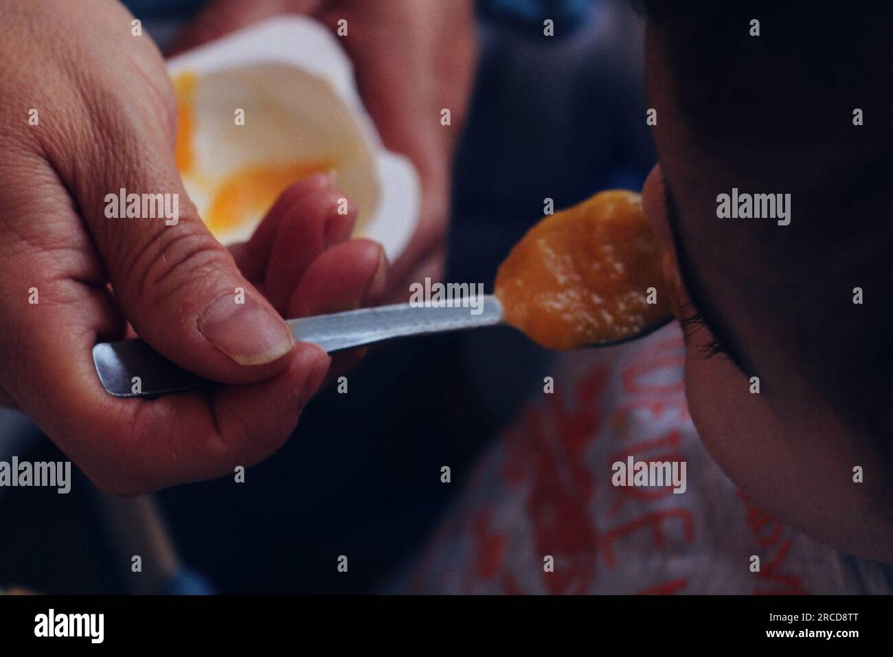 Baby eating hand hi-res stock photography and images - Alamy