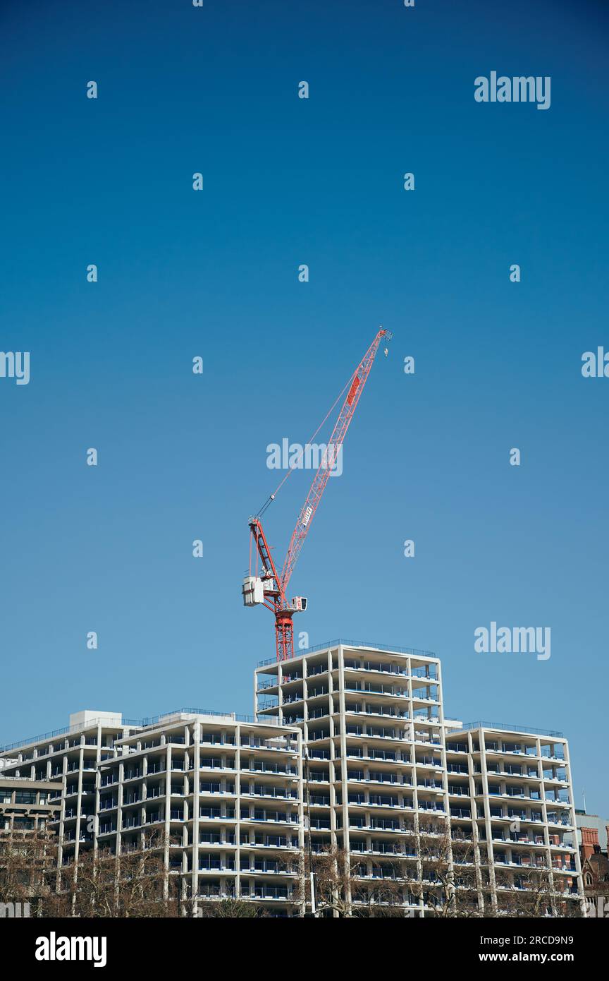 Tower crane constructing apartment buildings Stock Photo - Alamy