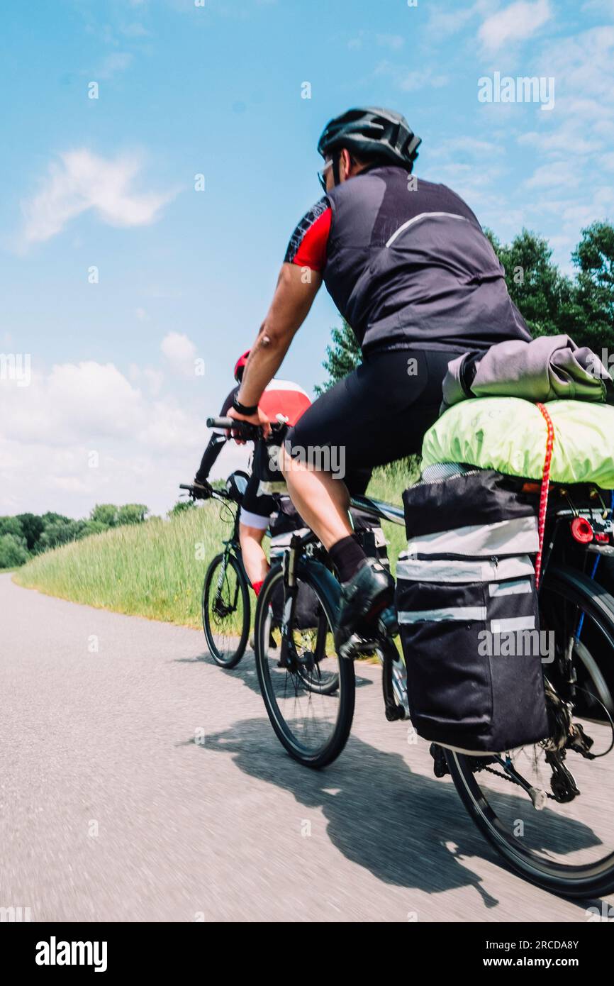 Two cyclists riding in the Rin Route, Germany Stock Photo - Alamy