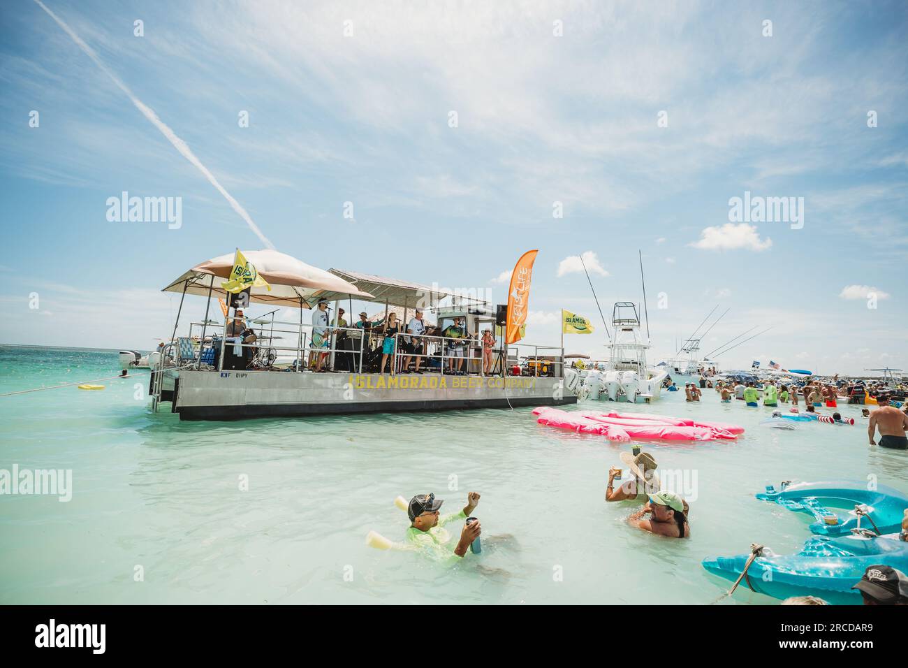 Live band plays on a boat in the Florida Keys to large happy crowd ...