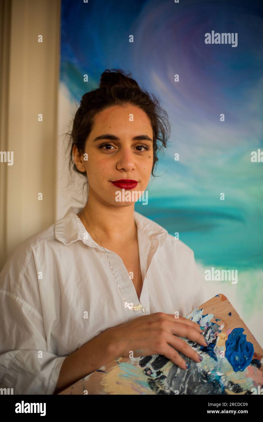 Female painter painting in her loft Stock Photo - Alamy