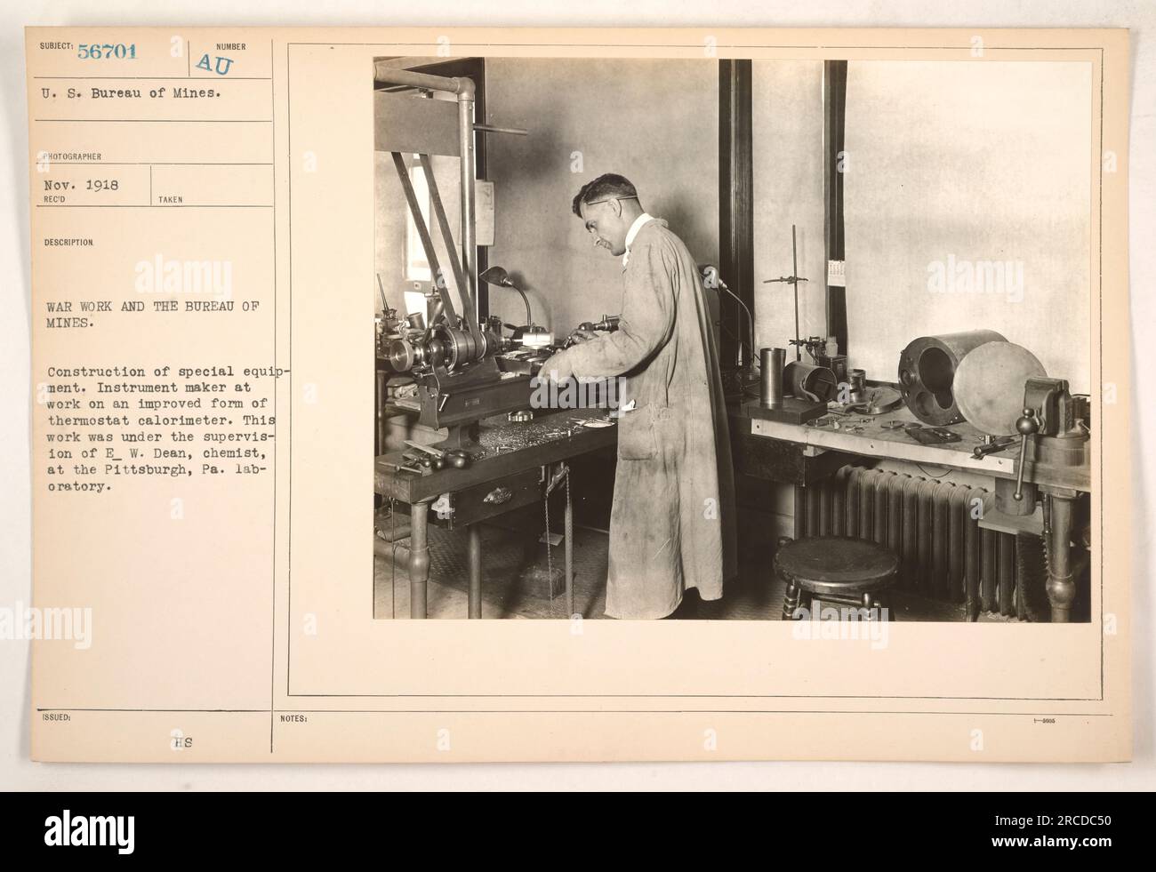 Instrument maker working on an improved thermostat calorimeter under ...