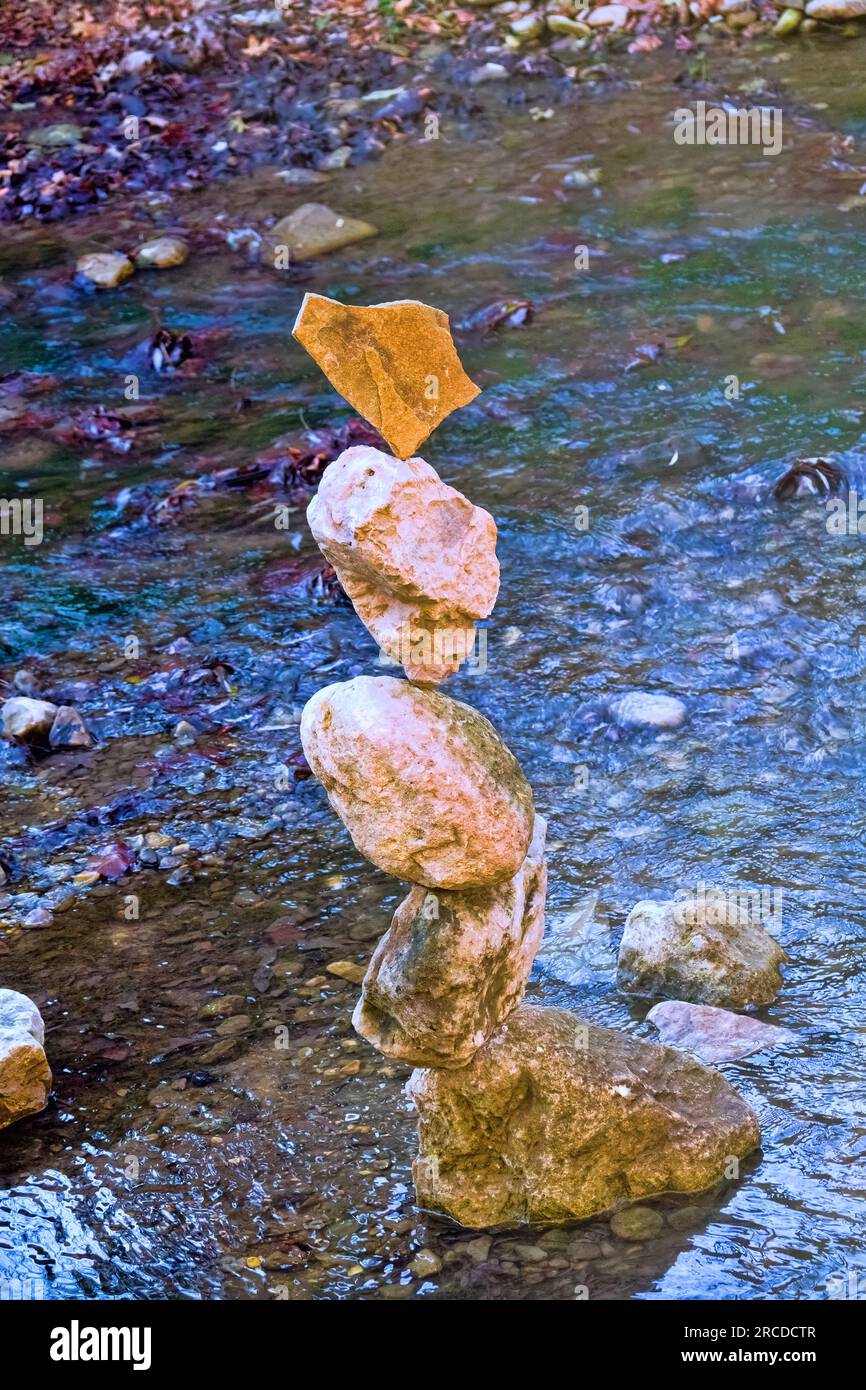 The arched decorative park bridge is built of stones (flat pebbles ...