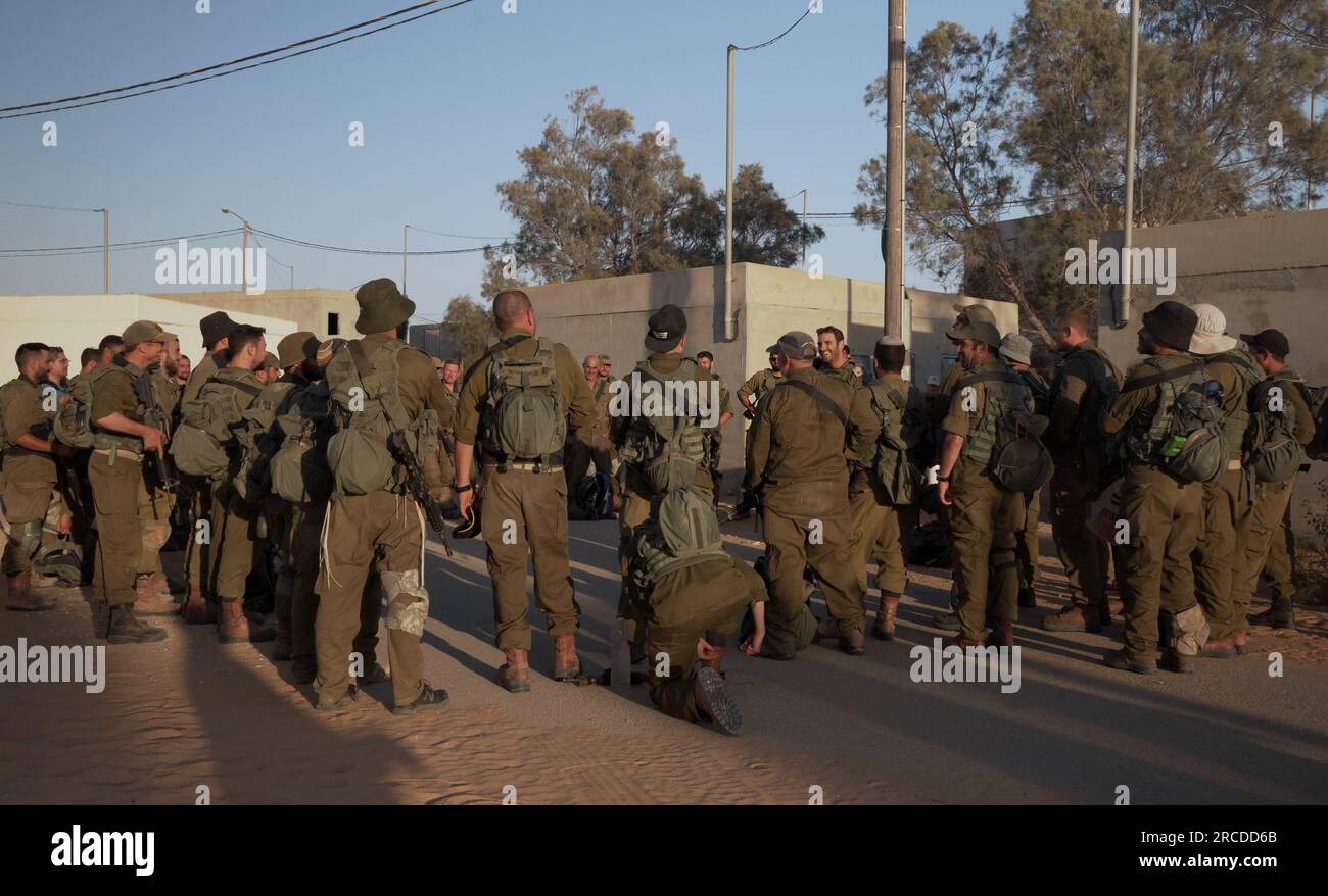 Israeli combat soldiers stand together in a simulated residential ...