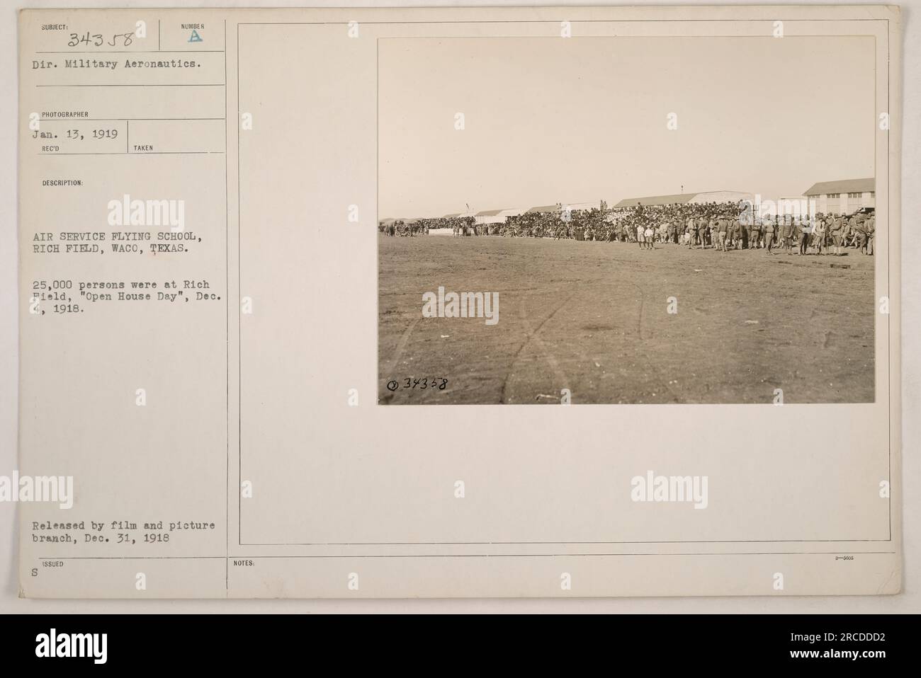 The photograph shows a crowd of 25,000 individuals attending the "Open ...