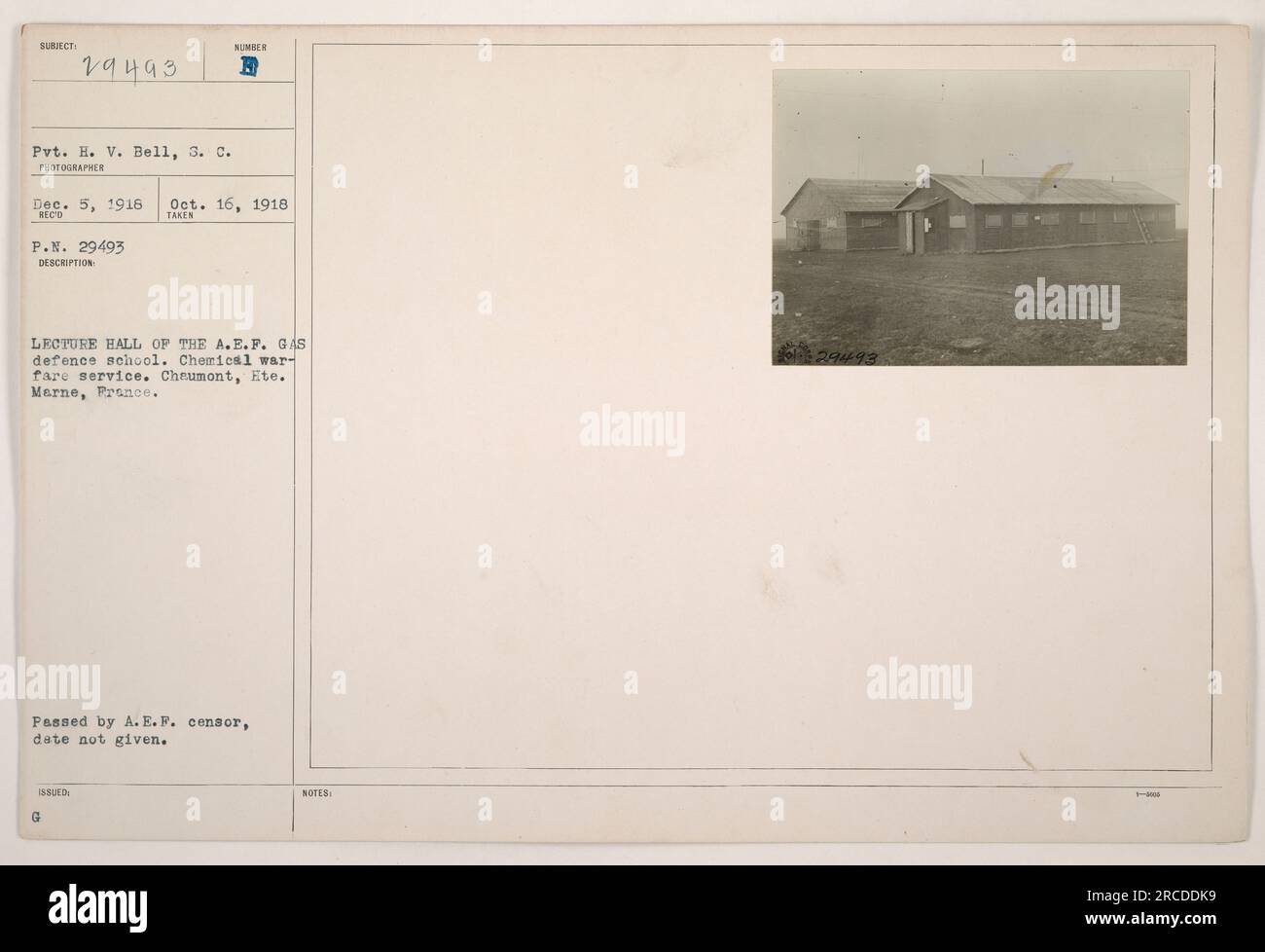 Photograph of Pvt. H. V. Bell attending a lecture in the lecture hall ...