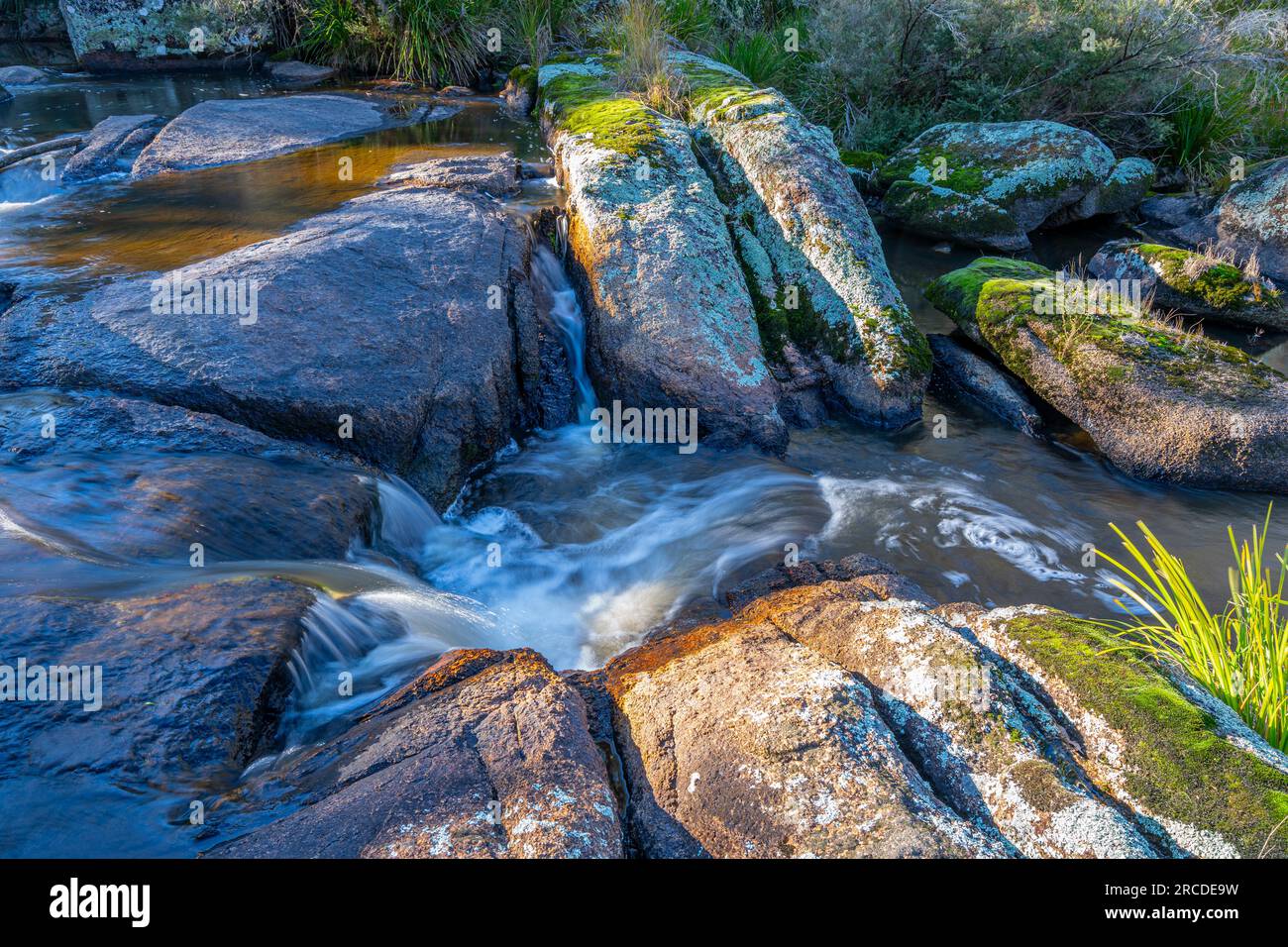 Small waterfall cascades over granite rocks, Glen Elgin Creek, New ...