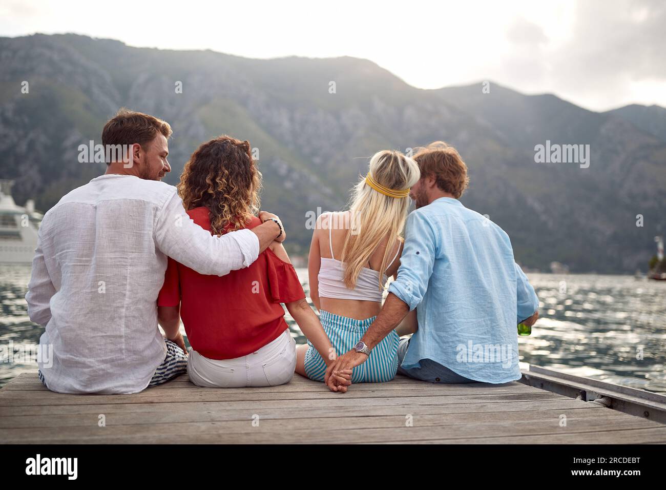 Cheat. Young Man and a girl cheat on their partners by holding hands ...