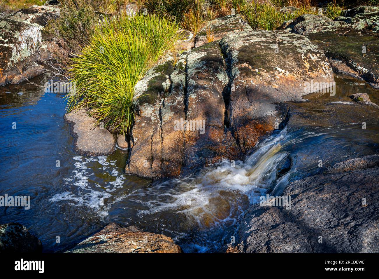 Small waterfall cascades over granite rocks, Glen Elgin Creek, New ...