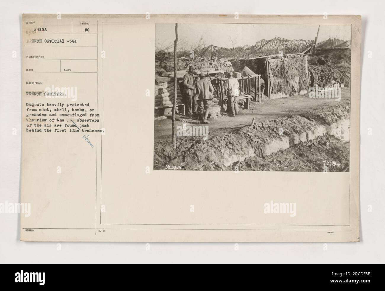 French soldiers take cover in heavily protected and camouflaged trench ...