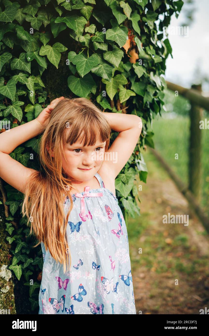 Sweet little kid girl playing outside, 4 year old preschooler child ...