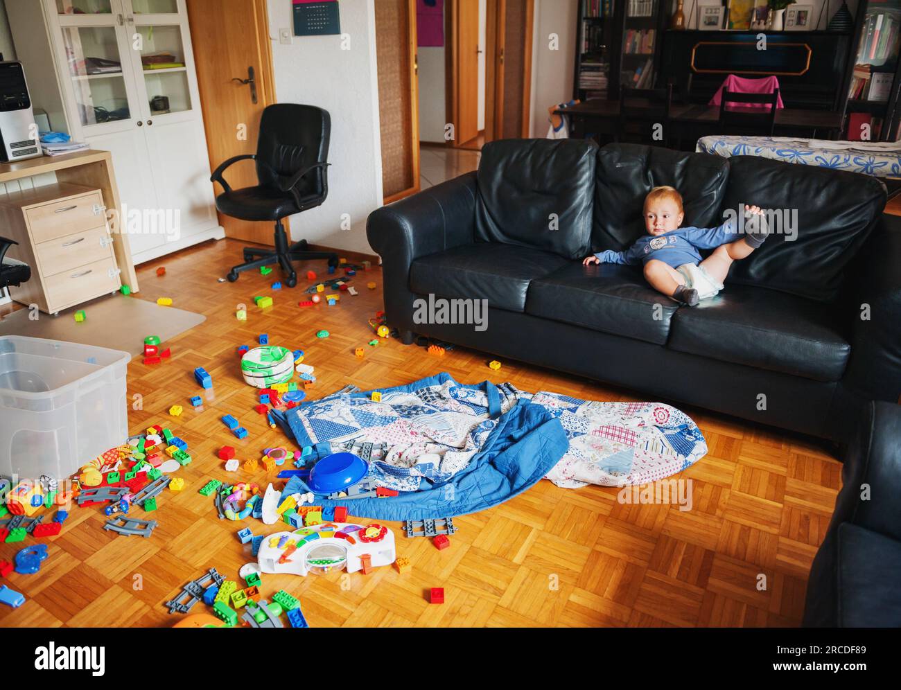 Adorable 1 year old baby boy with funny facial expression playing in a ...