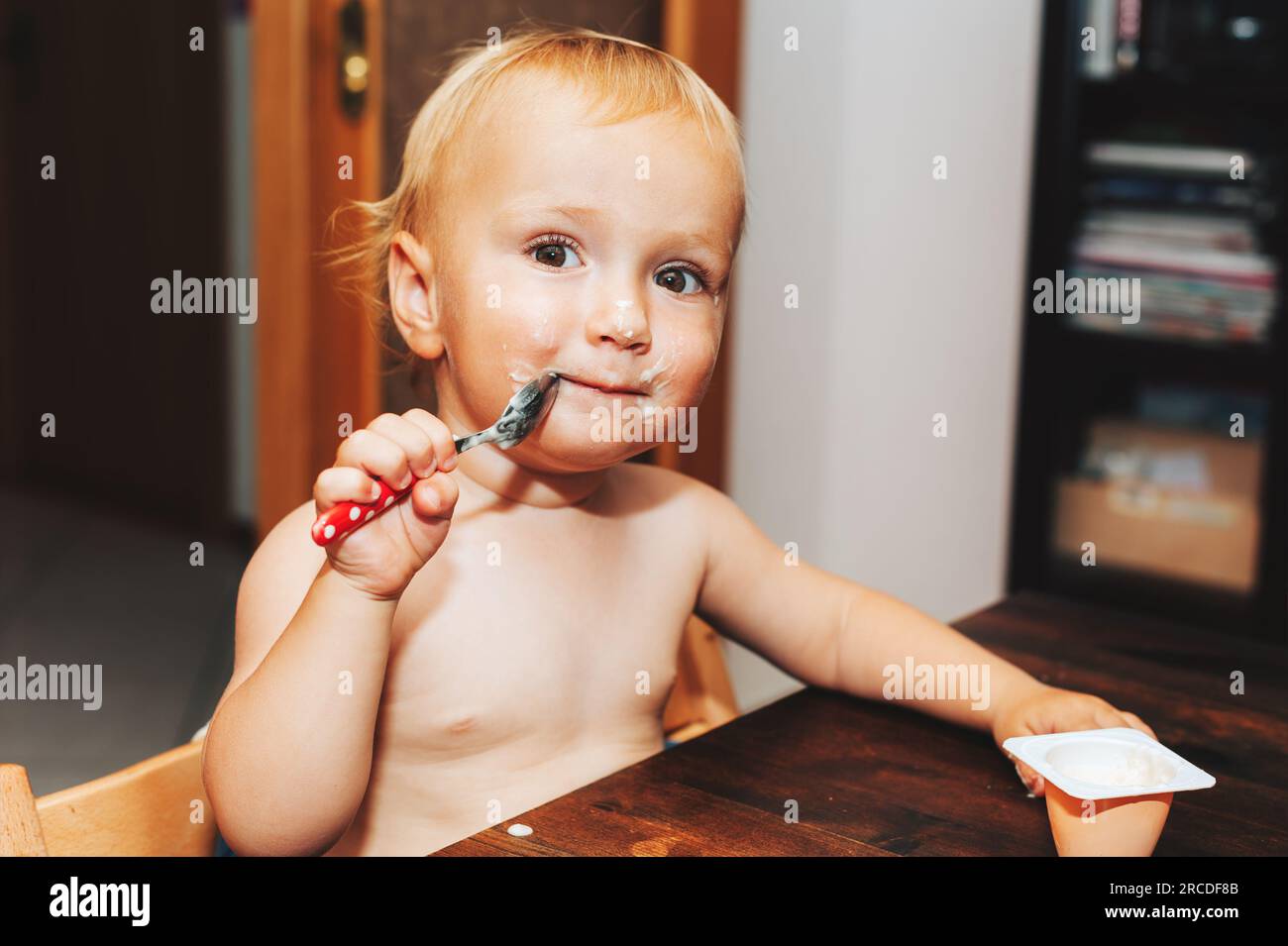 Boy eating, very messy face and table hi-res stock photography and ...