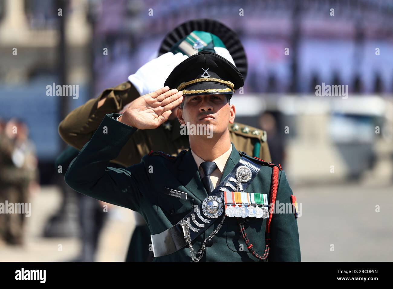 Indian soldiers salute during the Bastille Day military parade Friday ...