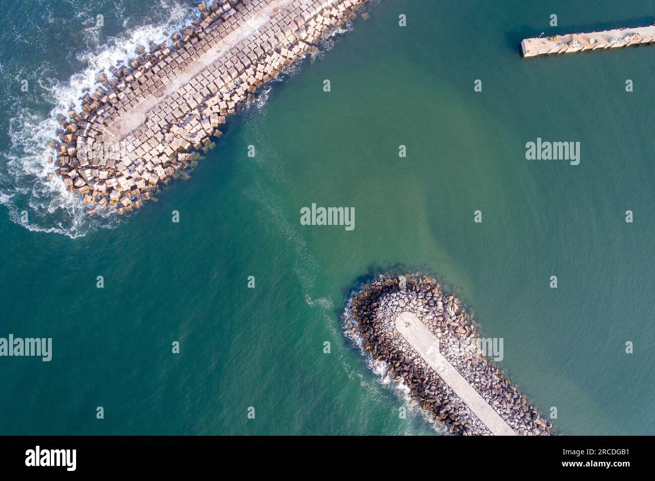 aerial view of a jetty at the entrance of a harbour Stock Photo - Alamy