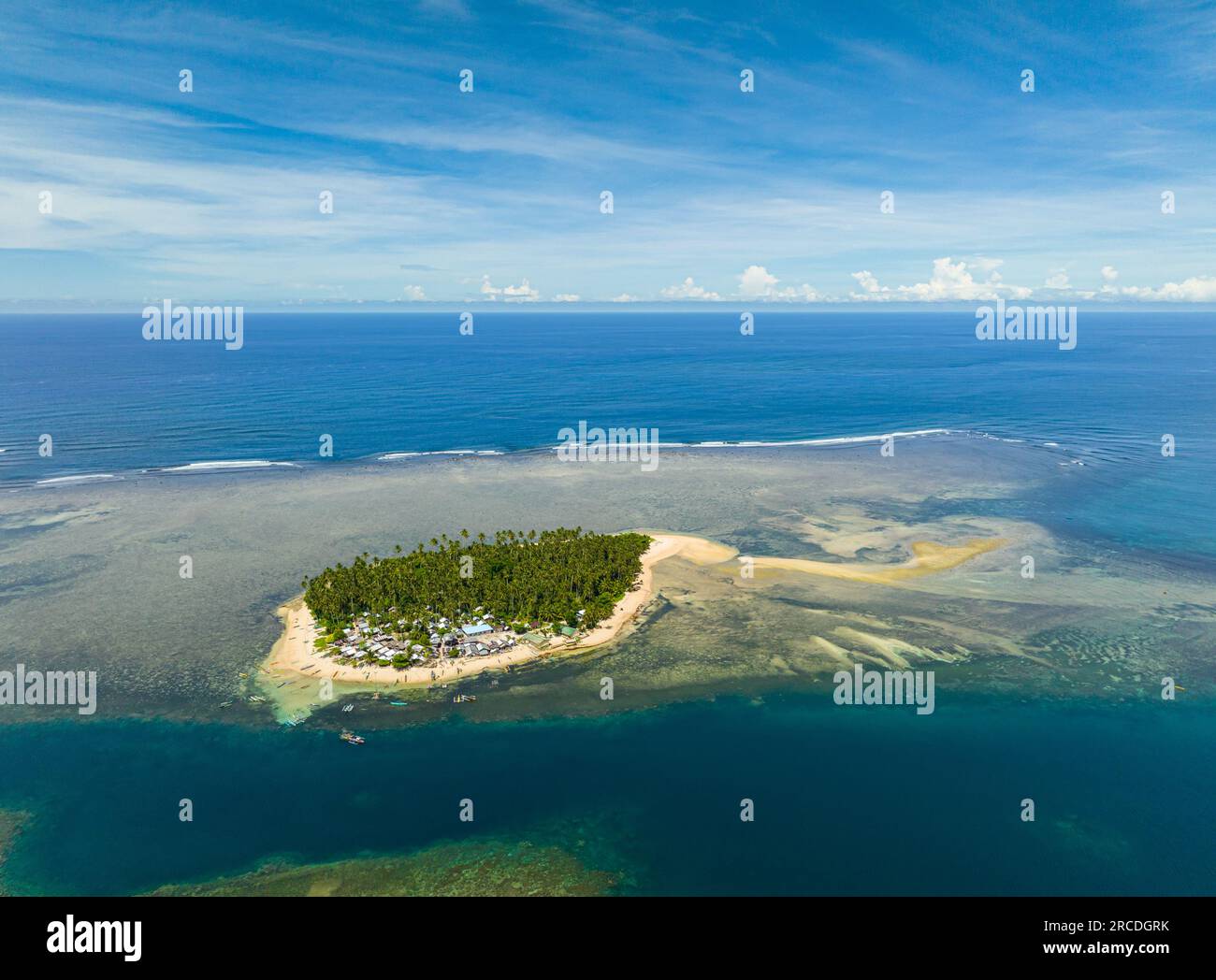 Tropical island with white sand in coastline. Coral reefs in turquoise ...