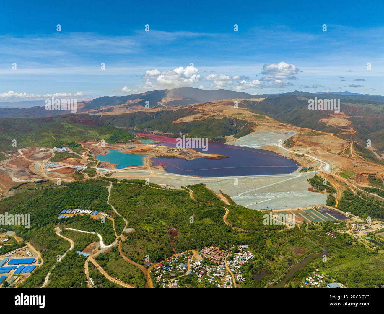 Nickel mining with forest in surroundings and villlages. Environtmental ...
