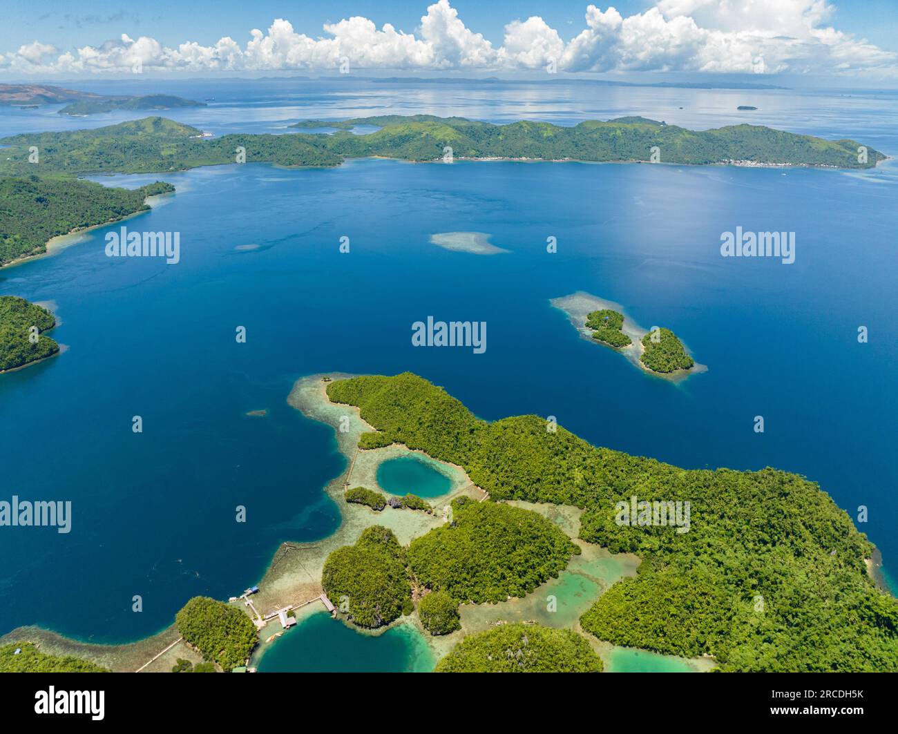 Overhead view of turquoise lagoon and beach in tropical island. Tinago ...