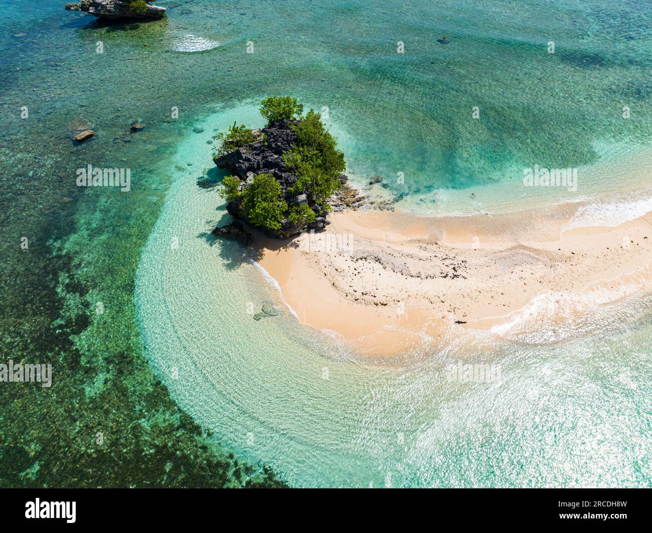 Air survey of beautiful sandbar with waves in tropical island and ...
