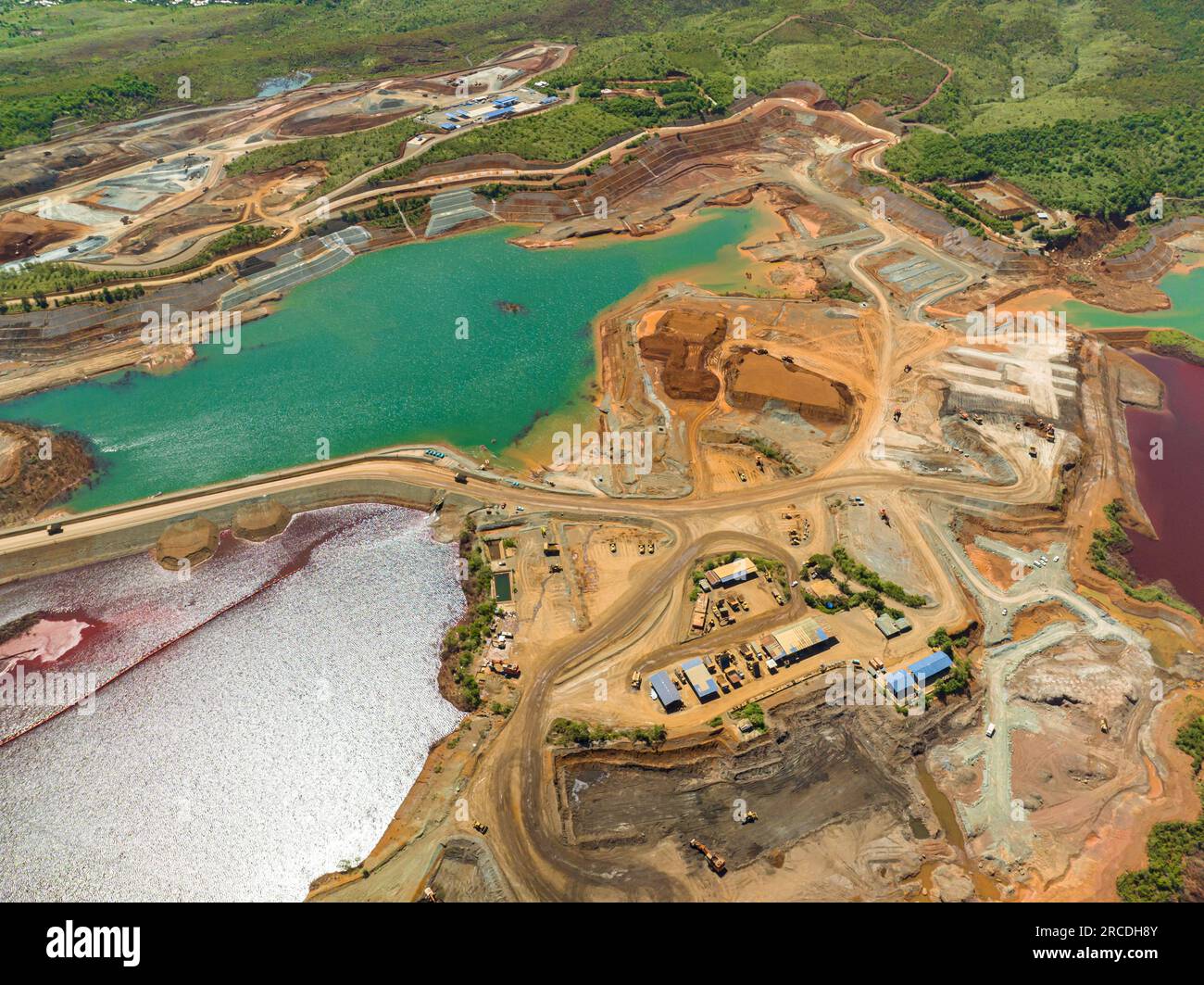 Aerial perspective of lake with polluted water in a nickel mine. Green ...