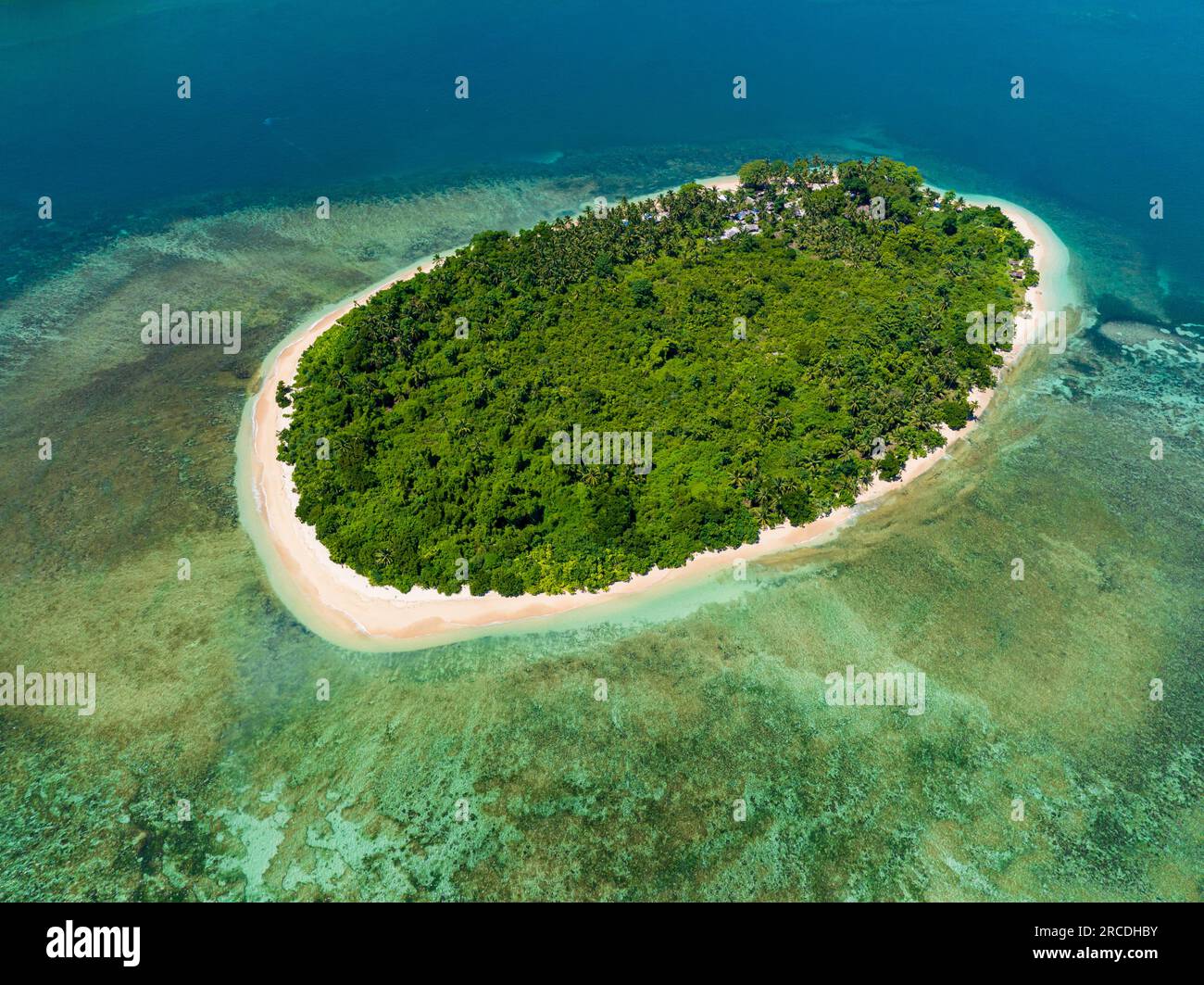 Aerial view of Island with a sandy beach and azure water surrounded by ...