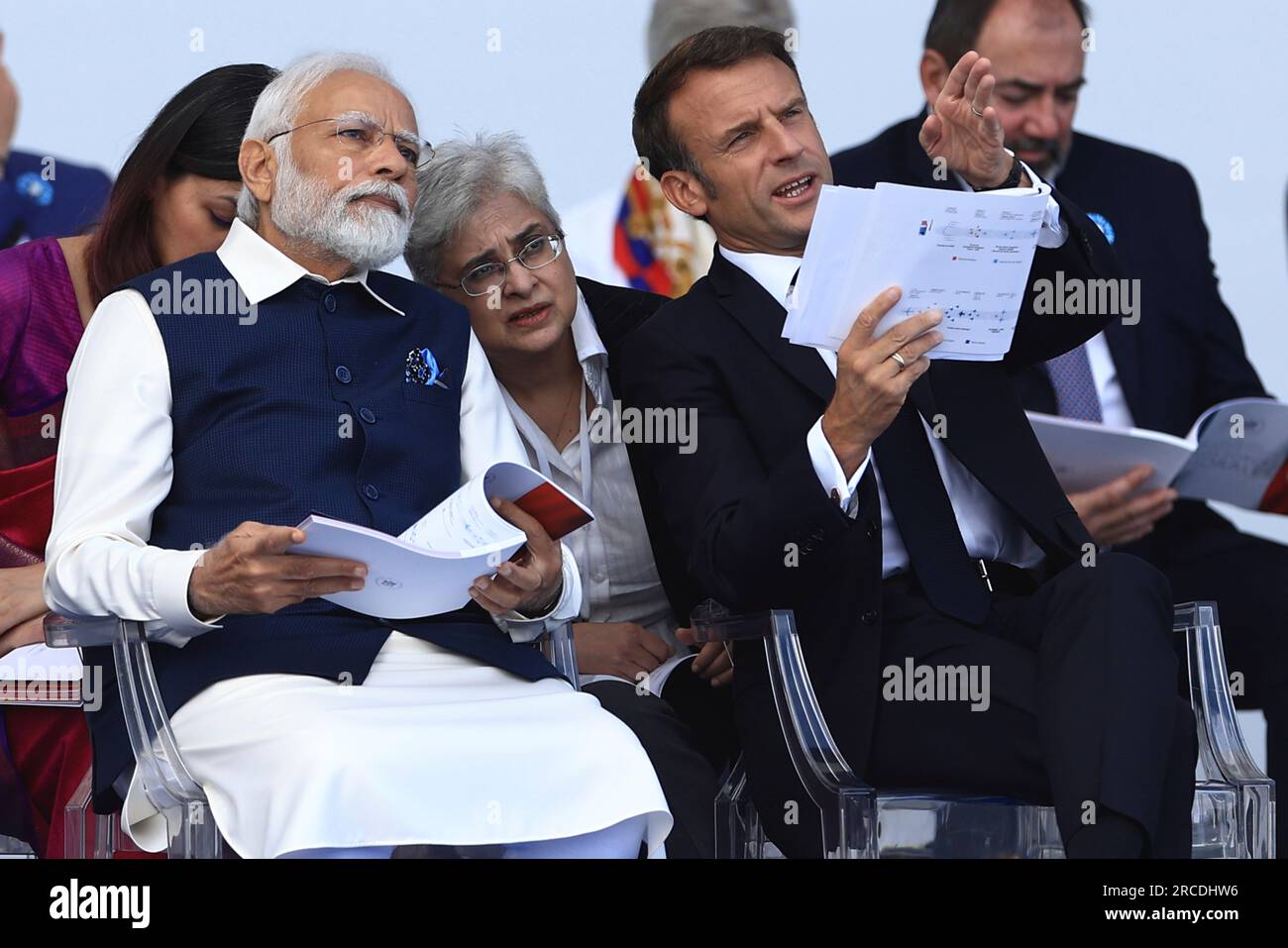 French President Emmanuel Macron talks to Indian Prime Minister Narendra Modi during the ...