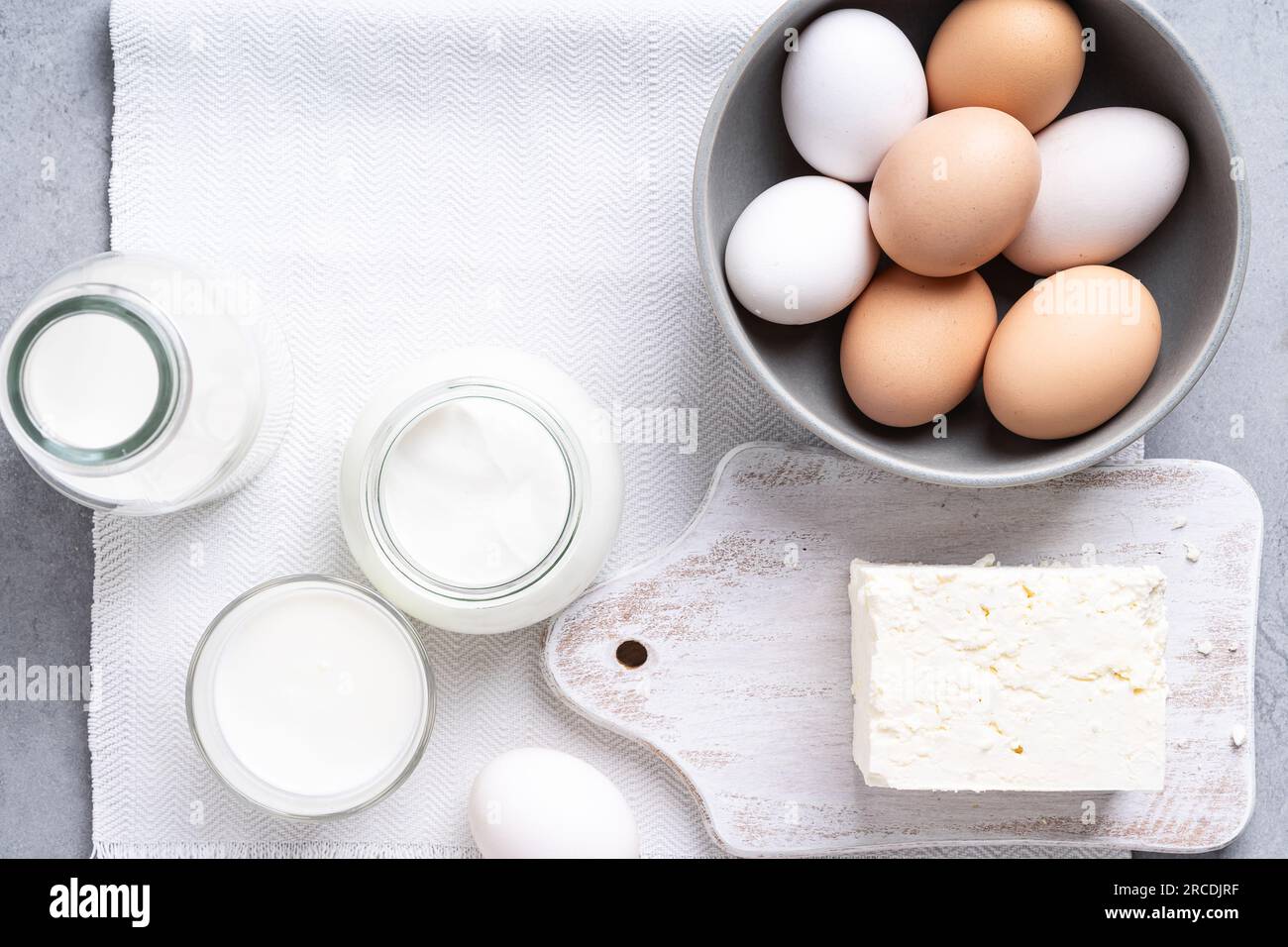 Top view of dairy products on on rustic background, fresh organic milk ...