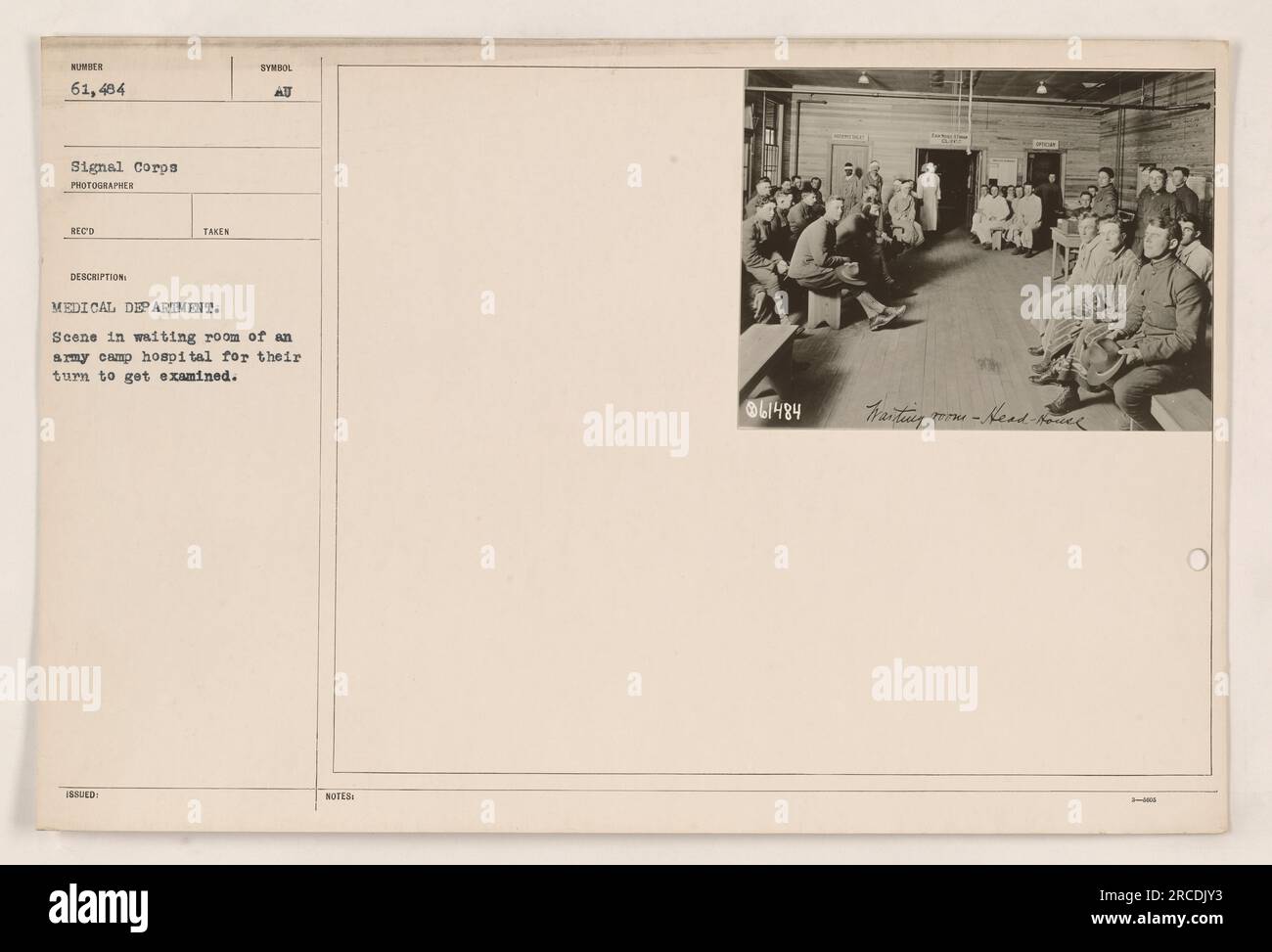 Soldiers wait in a crowded waiting room at an army camp hospital during ...