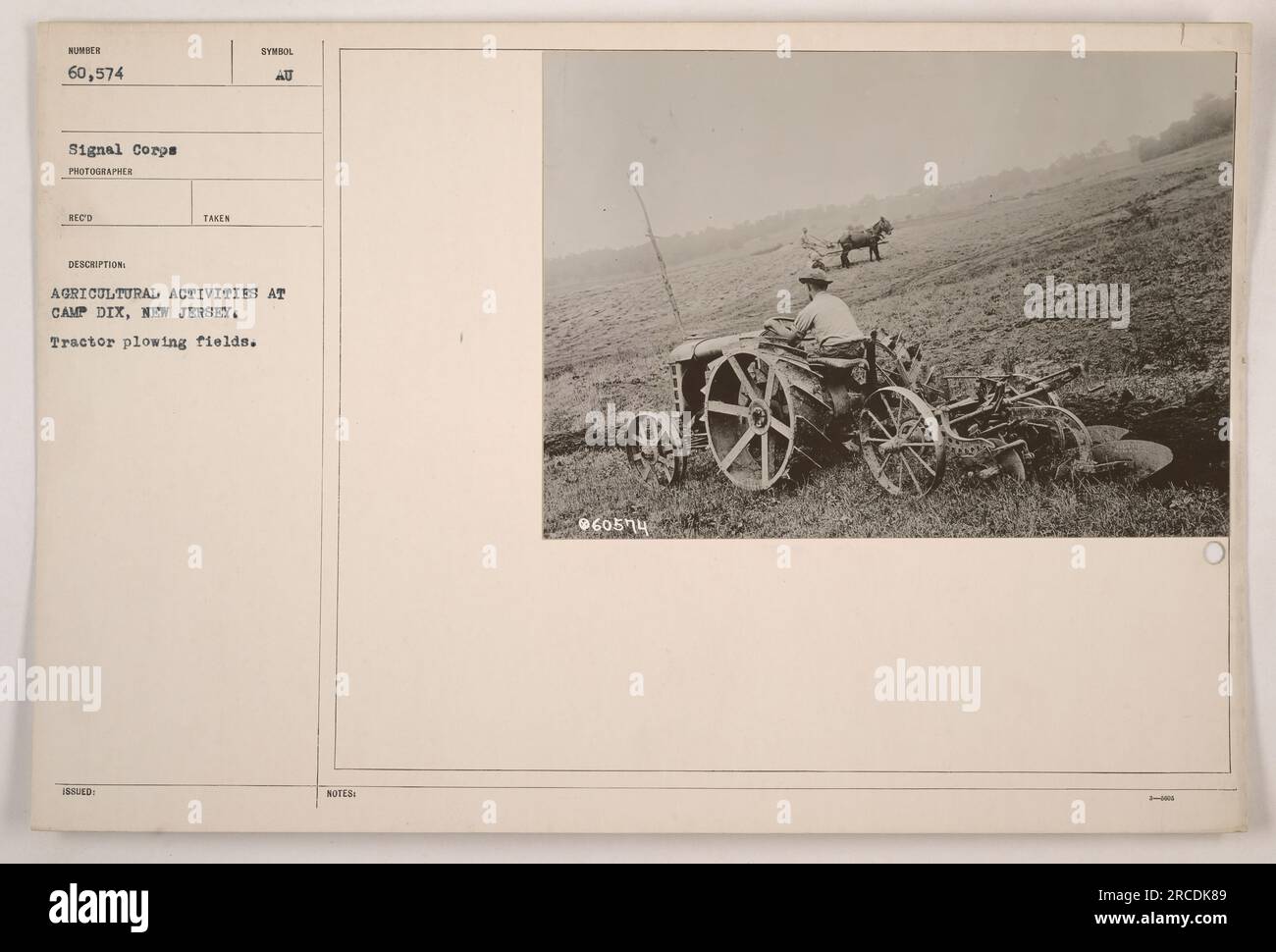 A tractor is seen plowing fields at Camp Dix, New Jersey during World ...