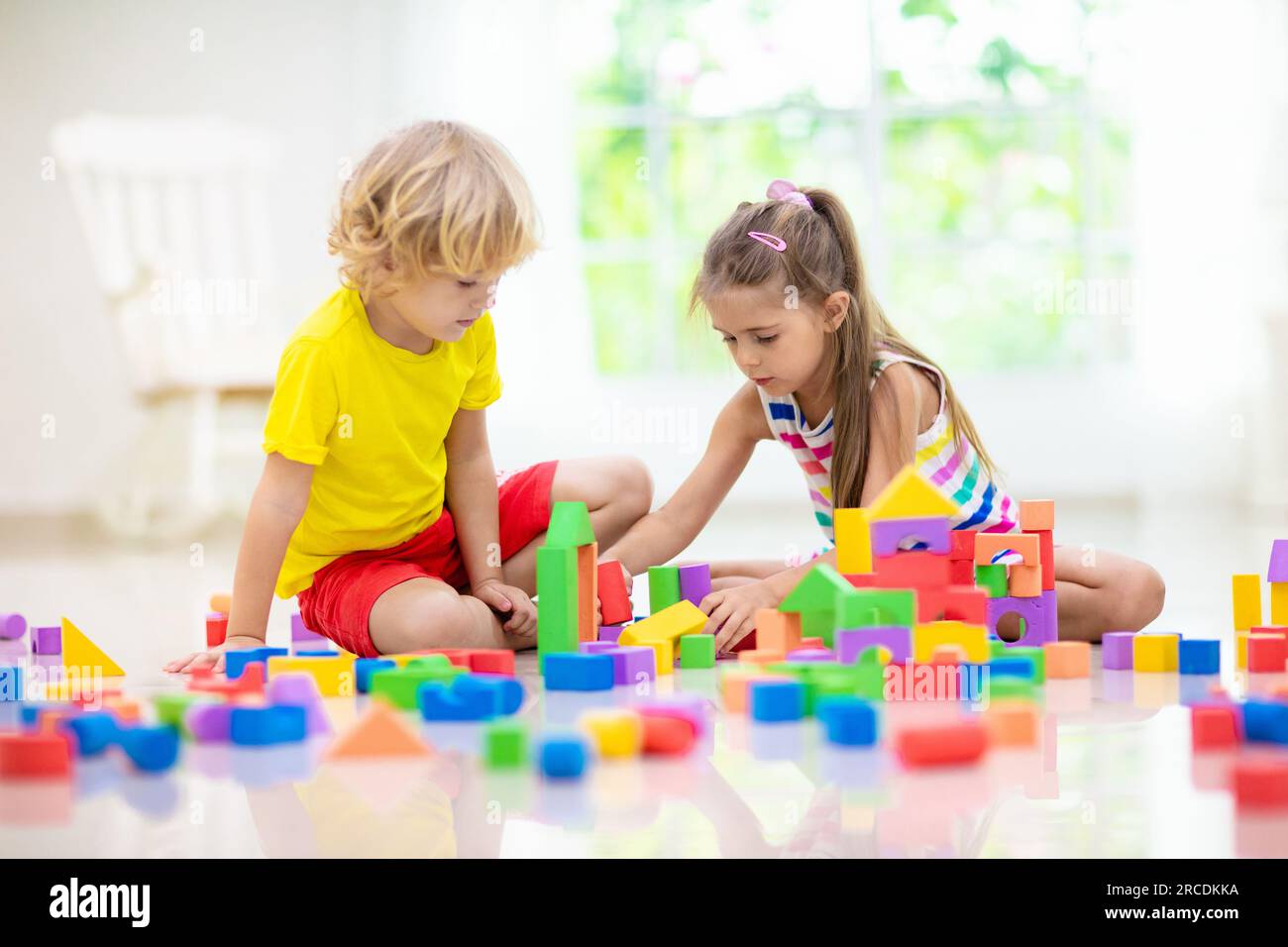 Girl build tower hi-res stock photography and images - Alamy