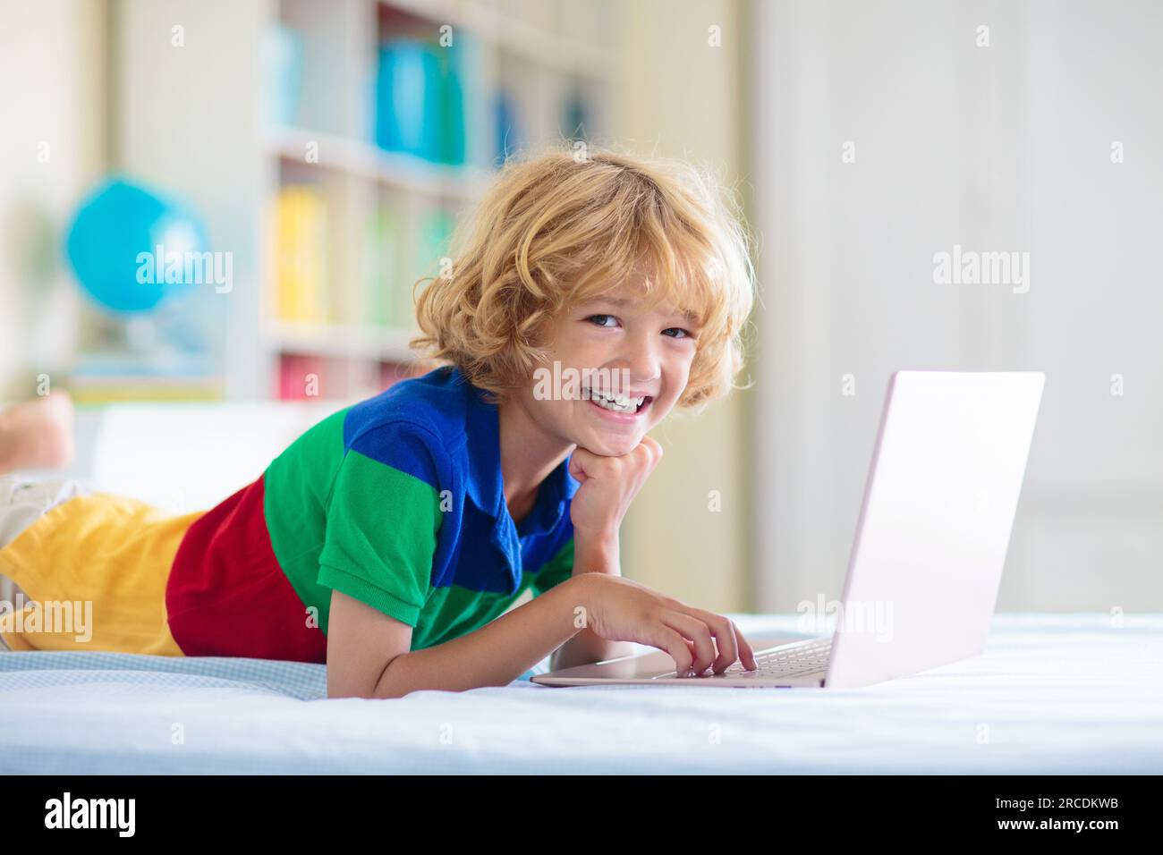 Child doing homework on computer. Online class. Homeschooling and ...