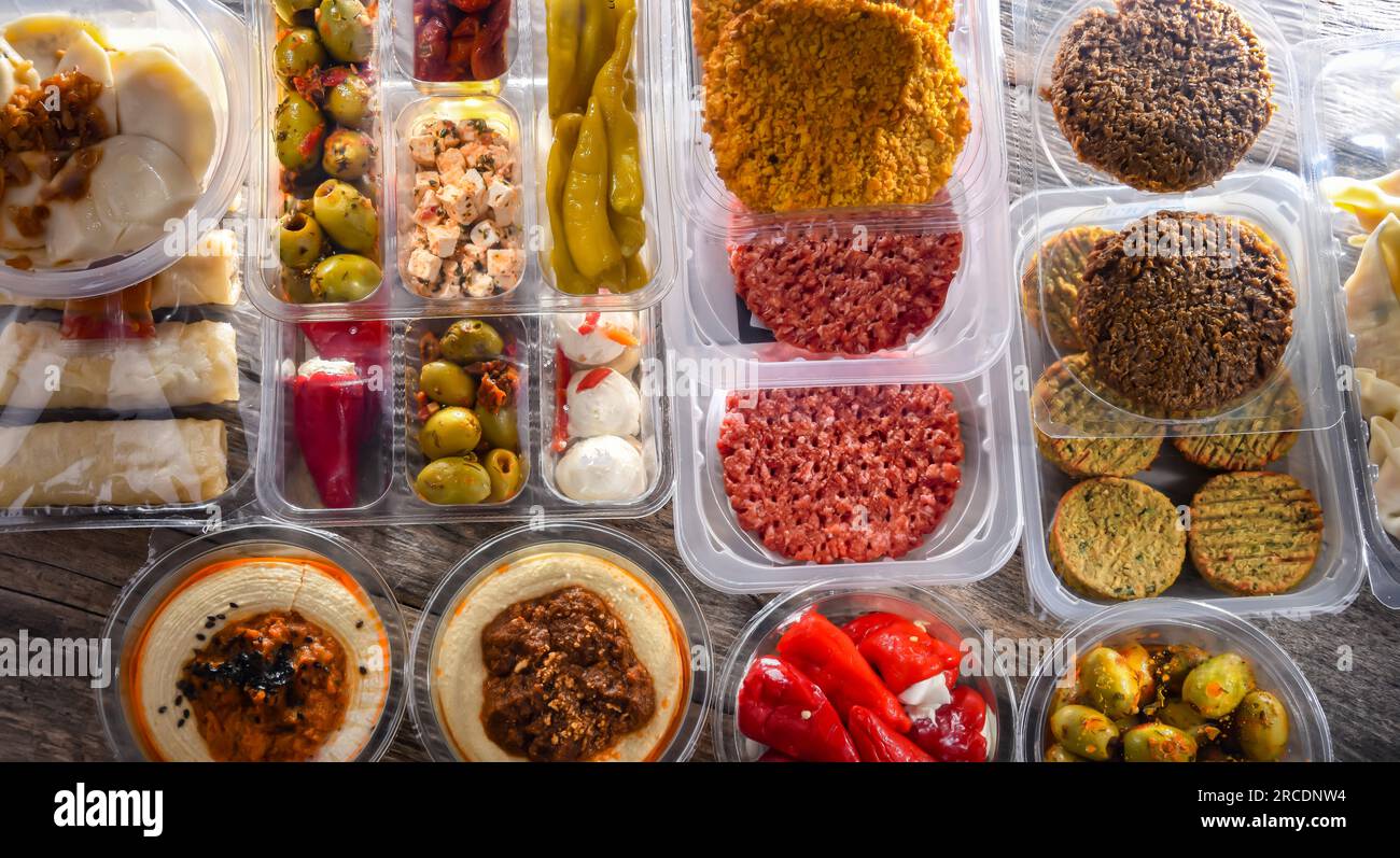 A display of variety of prepackaged food products in plastic boxes ...