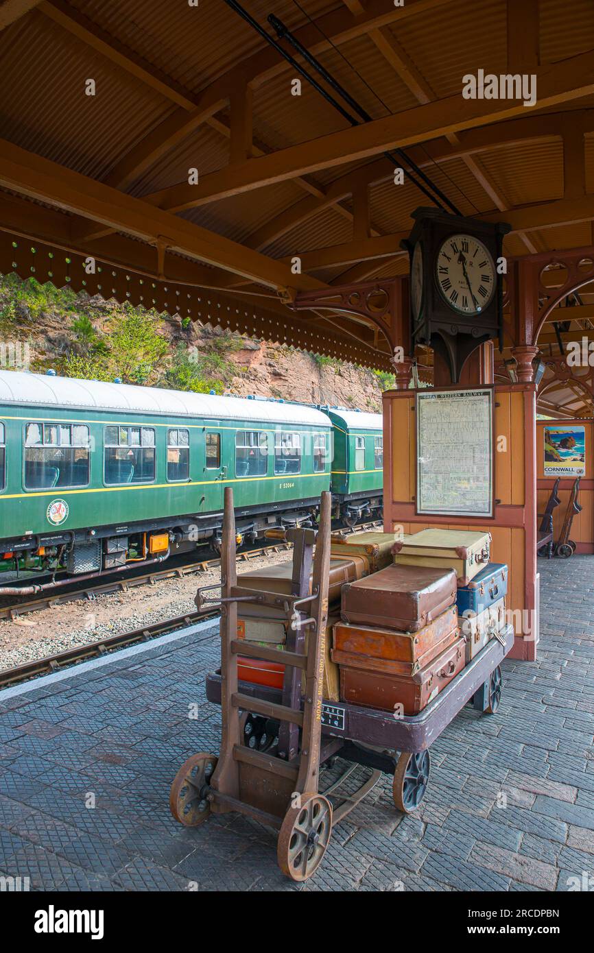Vintage suitcases on a luggage trolley on the platform of a UK heritage ...