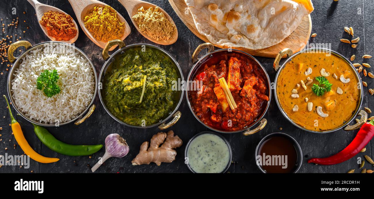 Composition with indian dishes: madras paneer, palak paneer and shahi ...