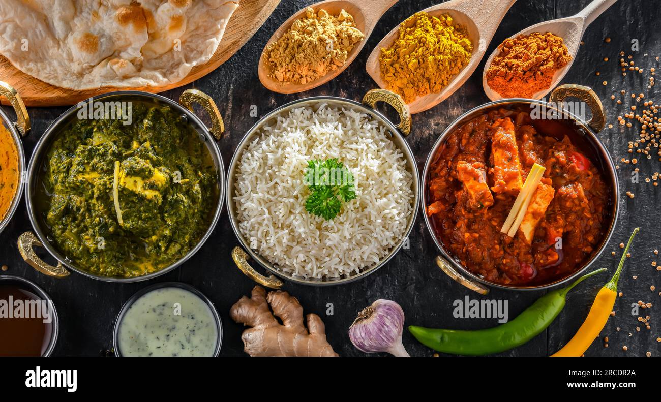 Composition with indian dishes: madras paneer, palak paneer and shahi ...