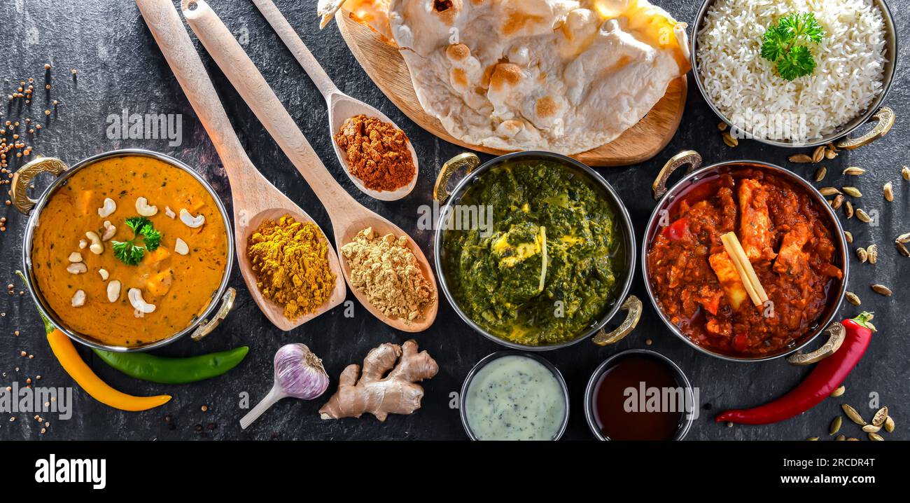 Composition with indian dishes: madras paneer, palak paneer and shahi ...