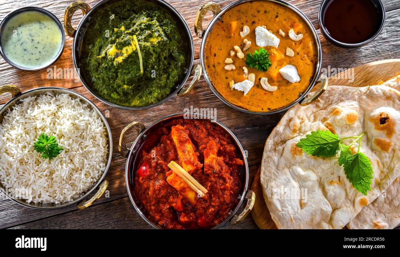 Composition with indian dishes: madras paneer, palak paneer and shahi ...