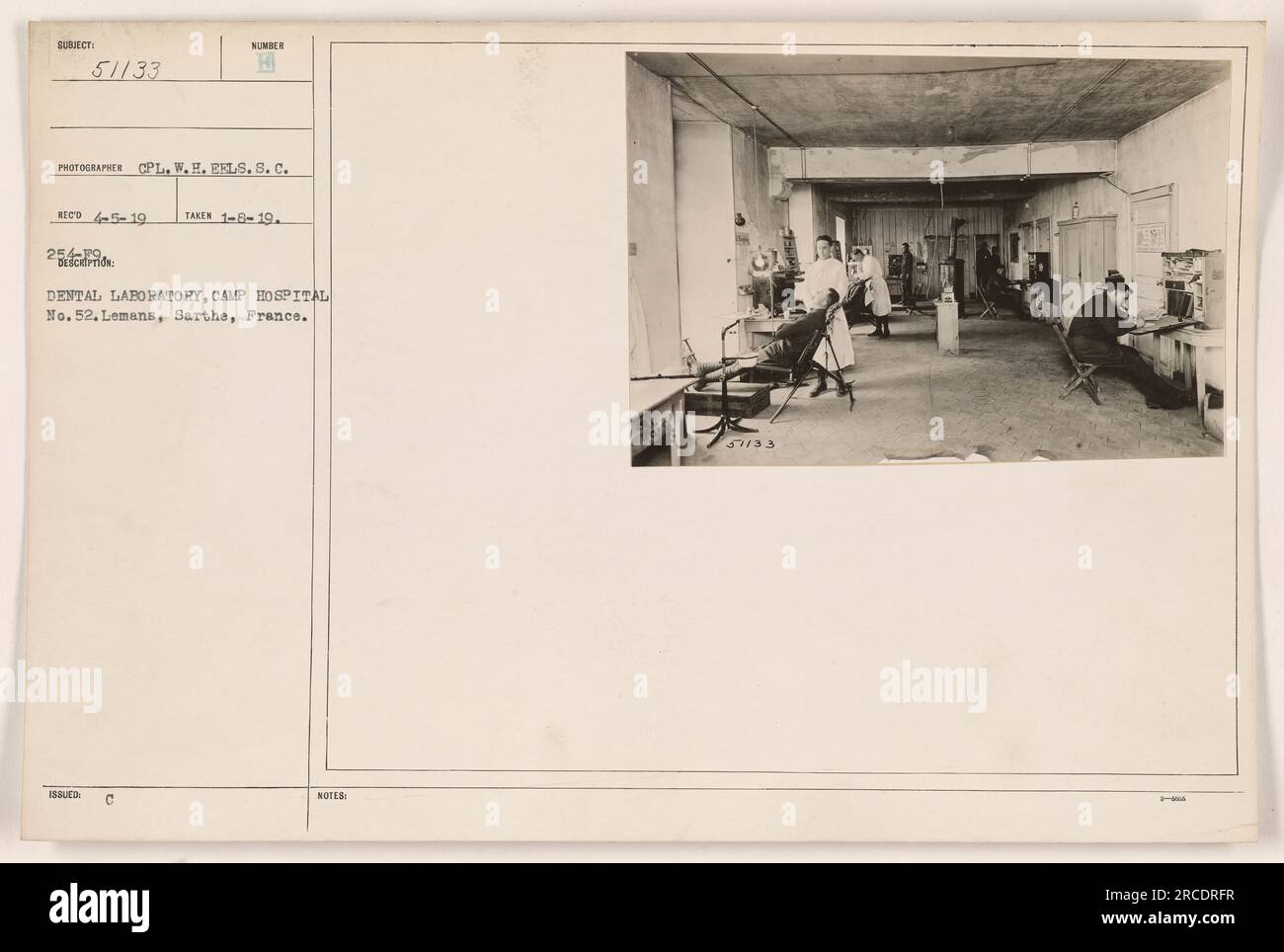 Image: A black and white photograph shows a dental laboratory situated ...
