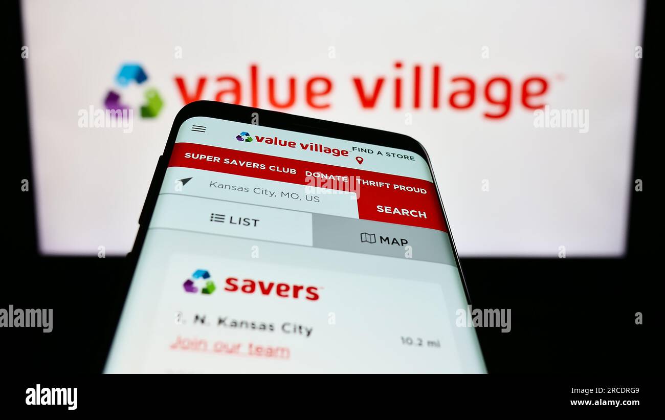 Mobile phone with webpage of retail company Value Village (Savers) on ...