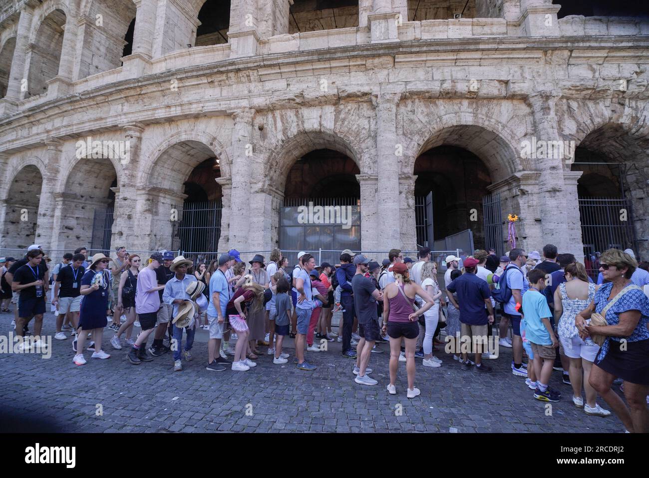 Rome, Italy. 14 July 2023 Tourists queuing at the Roman colosseum as ...